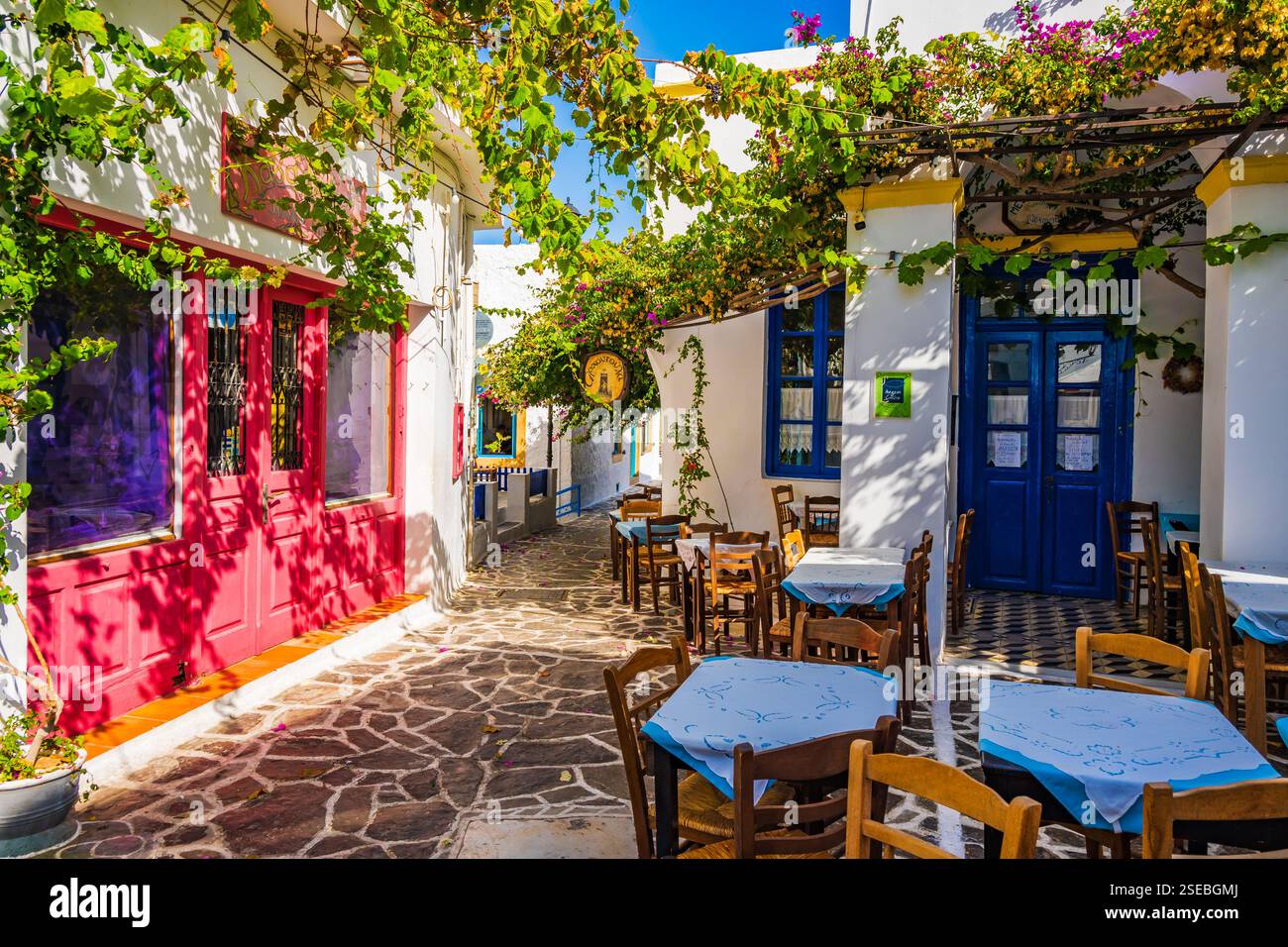 PLAKA VILLAGE, MILOS ISLAND - SEP 25, 2023: Chairs with tables in ...
