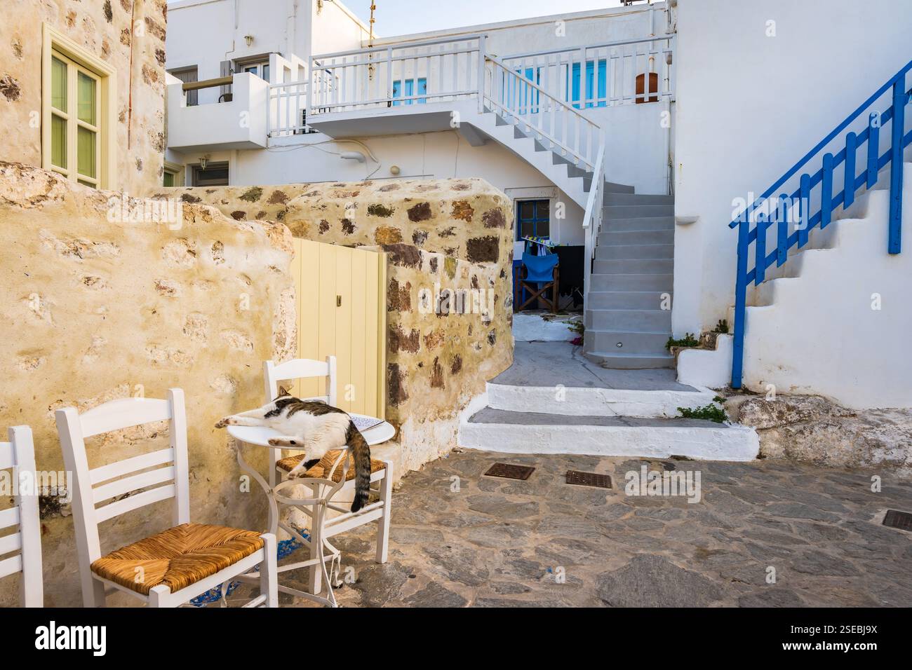Narrow streets of Plaka village with traditional white houses with ...