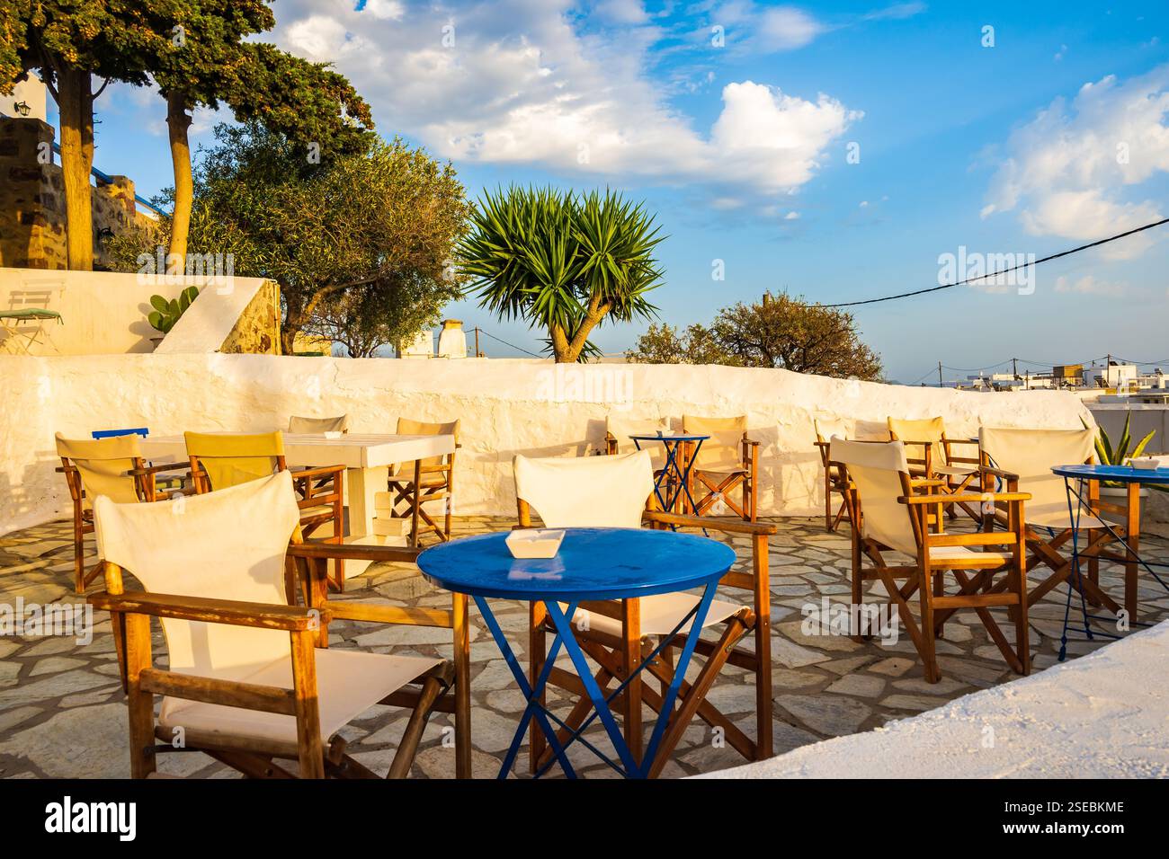 Chairs with tables on terrace of typical Greek tavern restaurant in ...