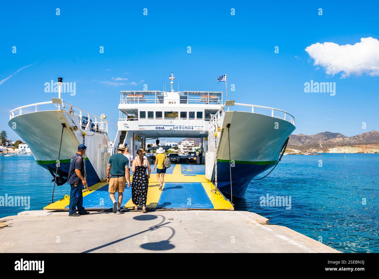 POLLONIA PORT, MILOS ISLAND - SEP 26, 2023: Tourists boarding ferry to ...