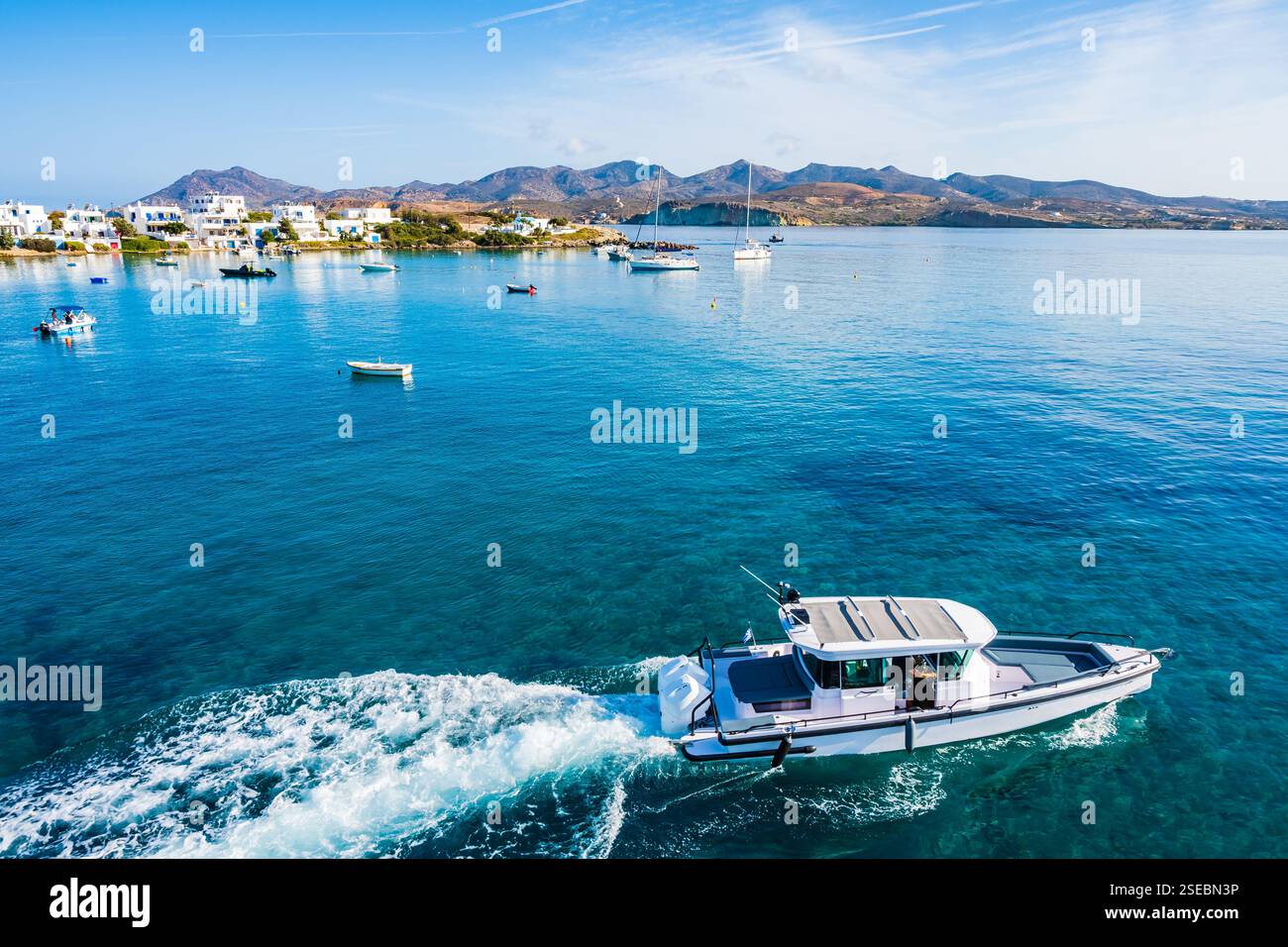 View of boat on sea and Pollonia port houses from deck ferry from ...