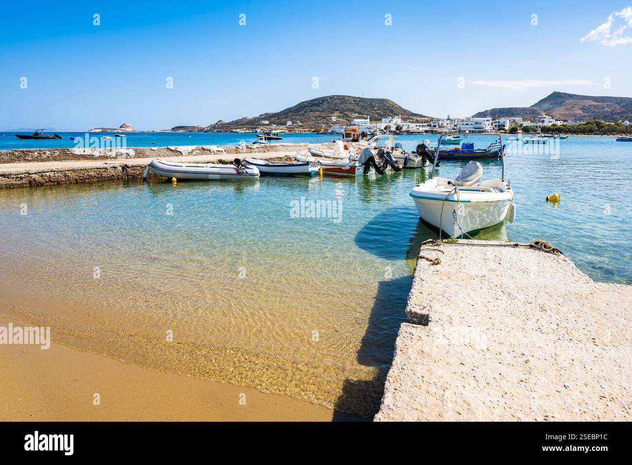 Typical Greek fishing boats in Pollonia port, Milos island, Cyclades ...