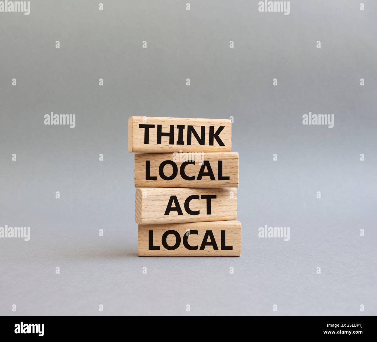 Think global act local symbol. Wooden blocks with words Think global ...