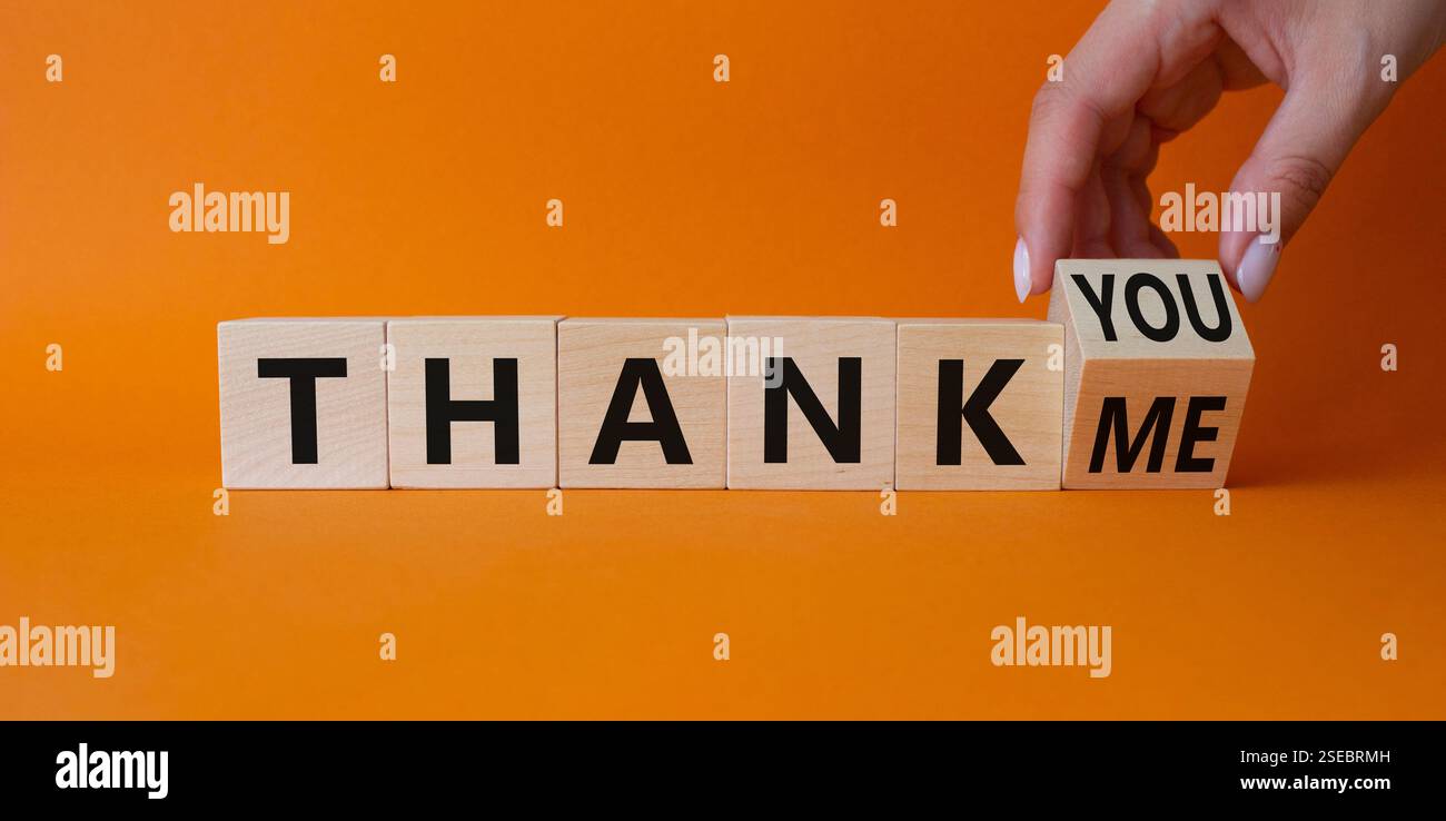 Thank You or Me symbol. Businessman Hand turns cubes and changes words ...