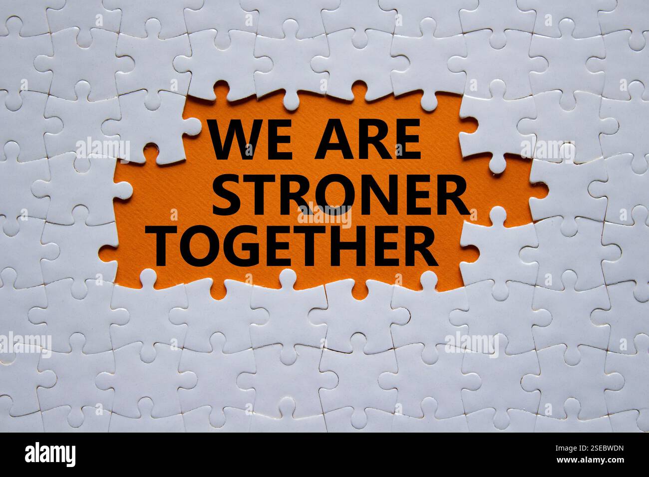 We are stronger together symbol. White puzzle with words We are ...