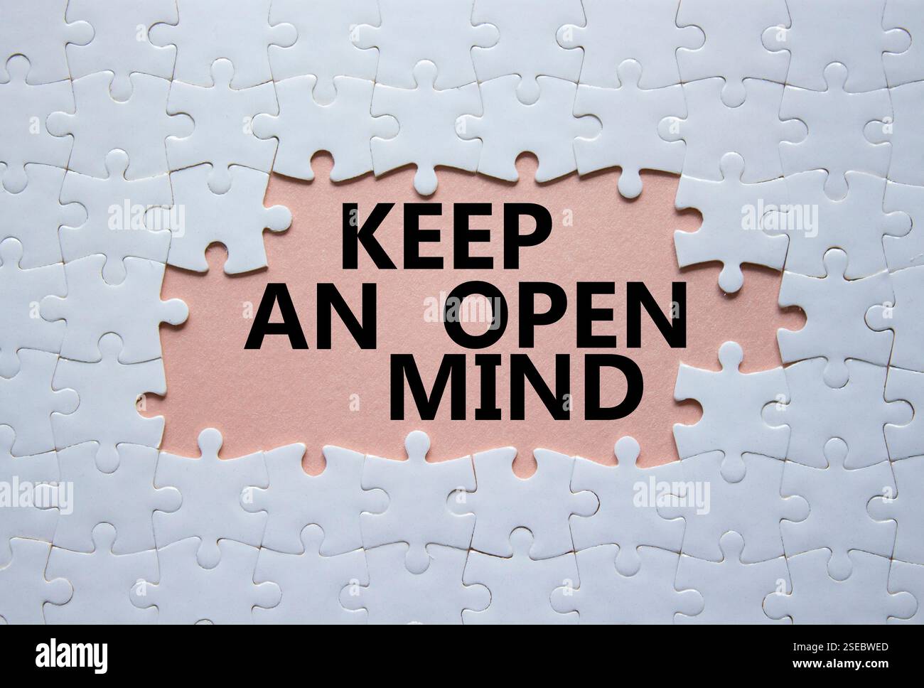 Keep an open mind symbol. White puzzle with words Keep an open mind ...