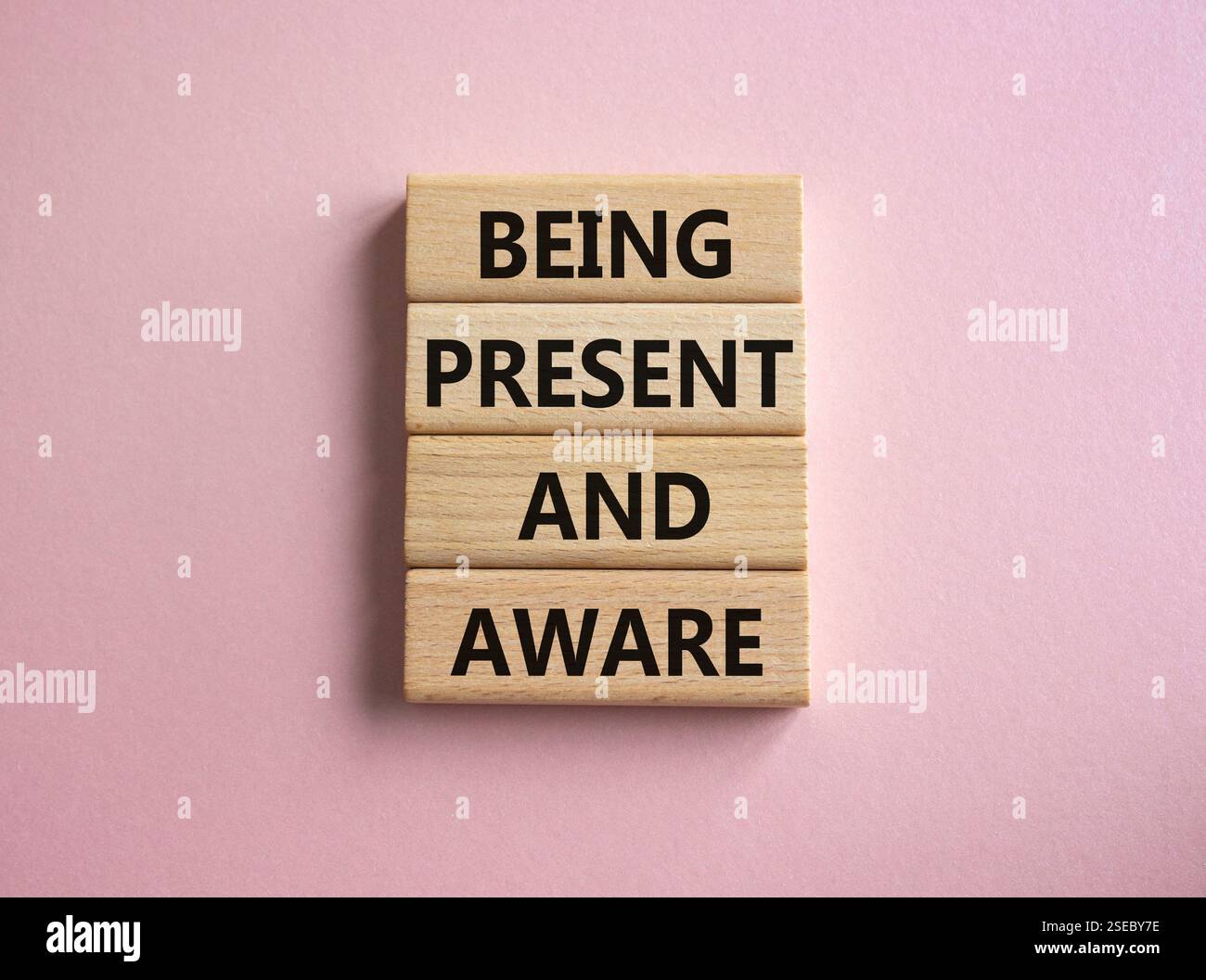 Being Present and Aware symbol. Wooden blocks with words Being Present ...