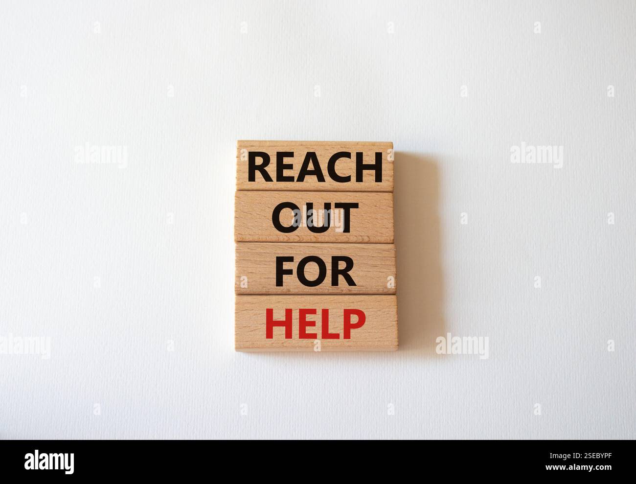 Reach out for help symbol. Wooden blocks with words Reach out for help ...