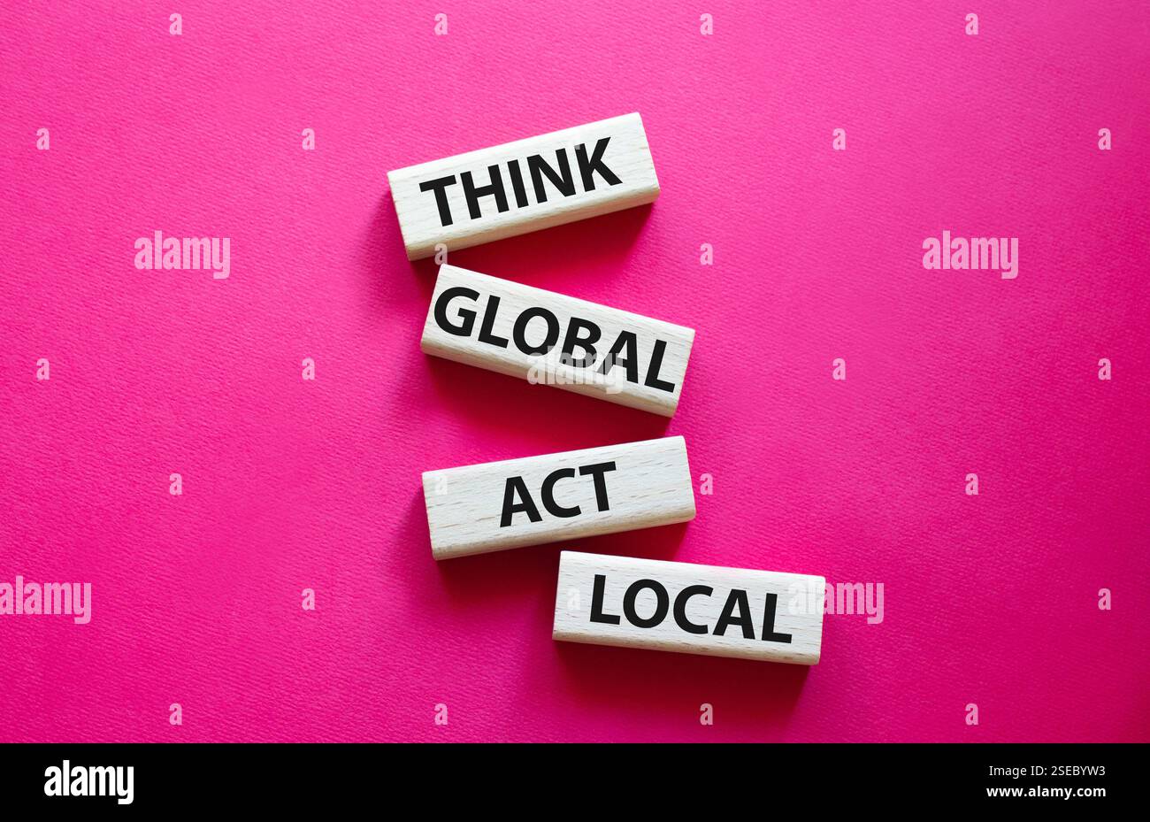Think global act local symbol. Wooden blocks with words Think global ...