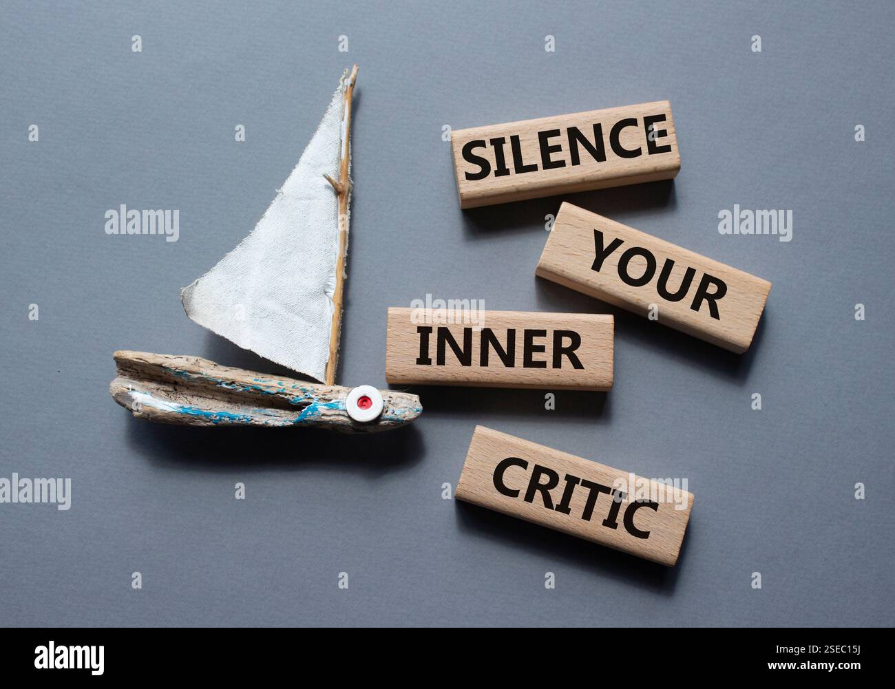 Silence your inner critic symbol. Wooden blocks with words Silence your ...