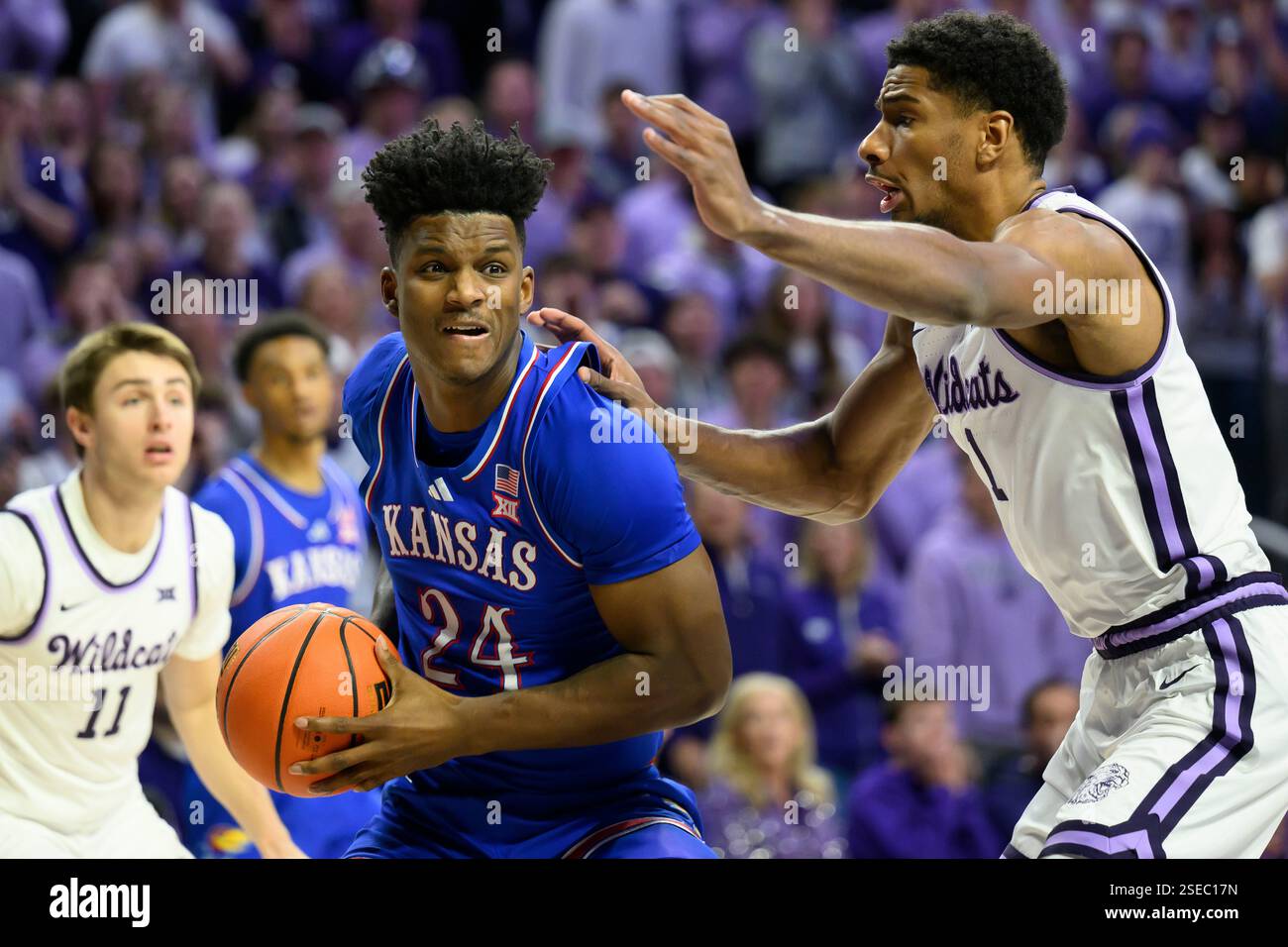 Kansas forward KJ Adams Jr. (24) drives against Kansas State guard ...