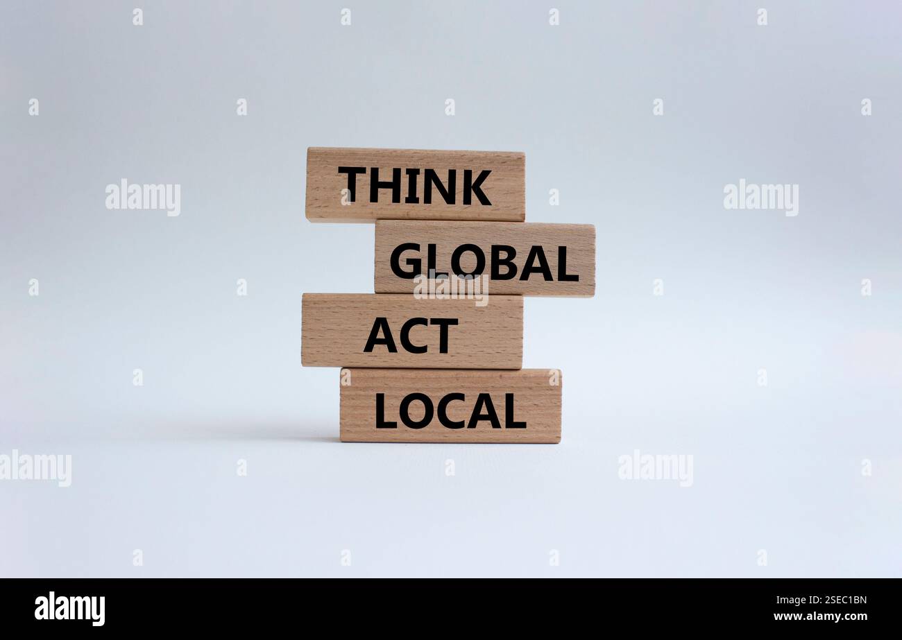 Think global act local symbol. Wooden blocks with words Think global ...