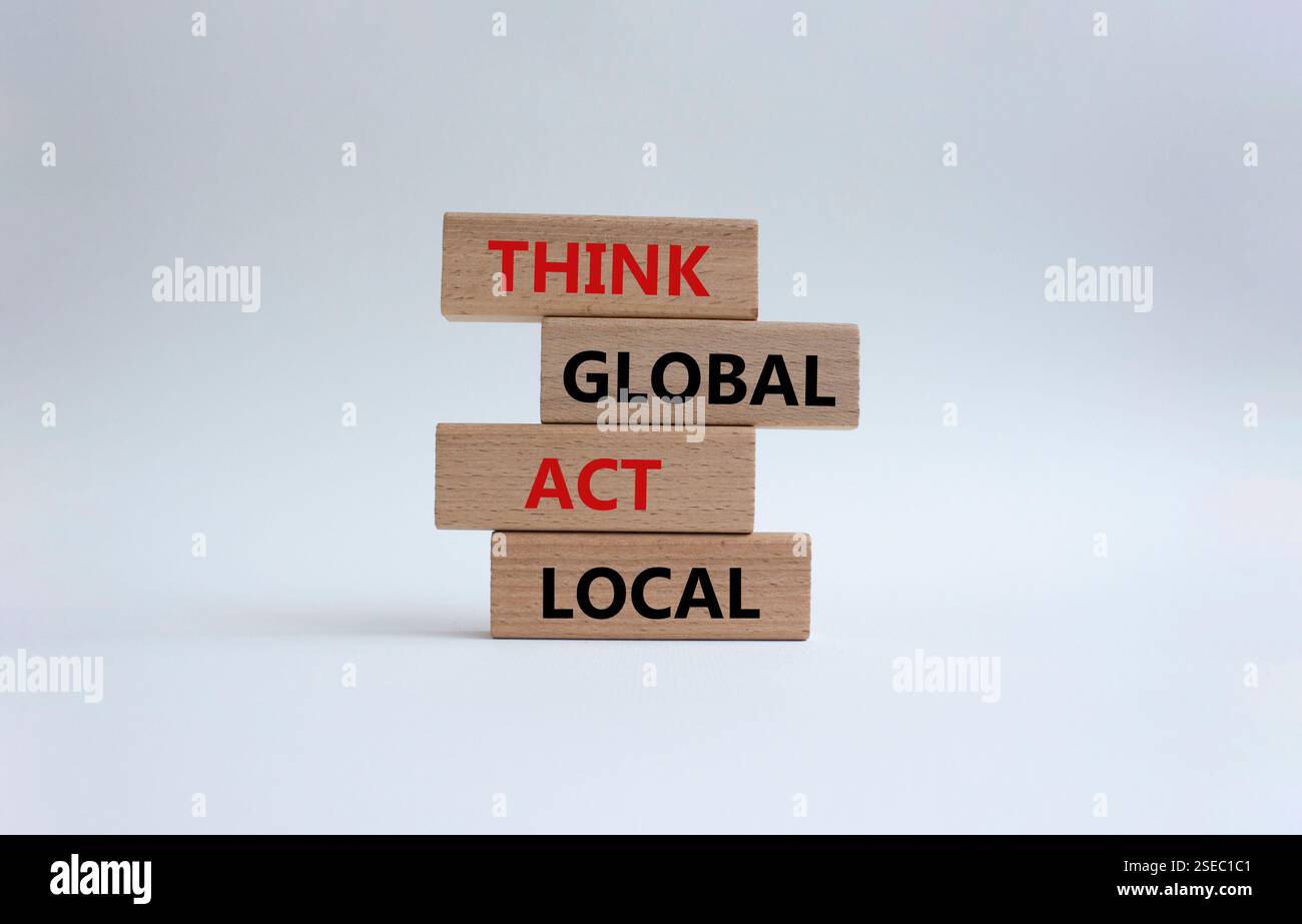 Think global act local symbol. Wooden blocks with words Think global act local. Beautiful white ...