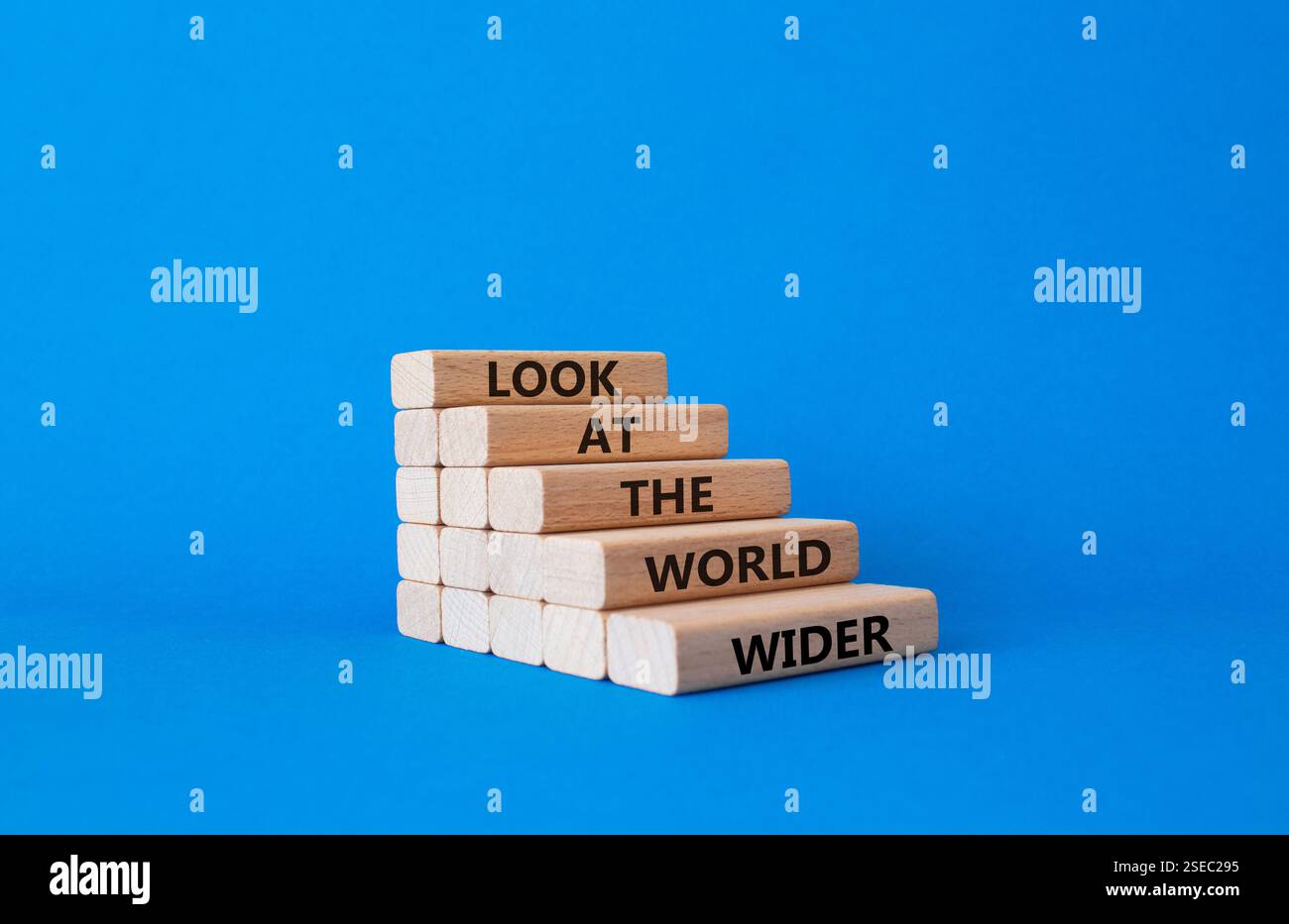 Look at the world wider symbol. Wooden blocks with words Look at the ...