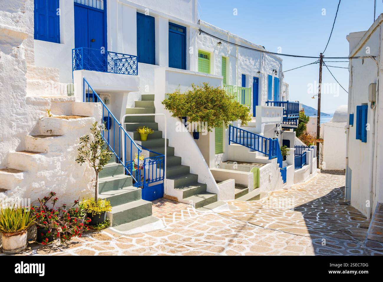 Narrow streets with typical Greek style architecture in Kimolos village ...
