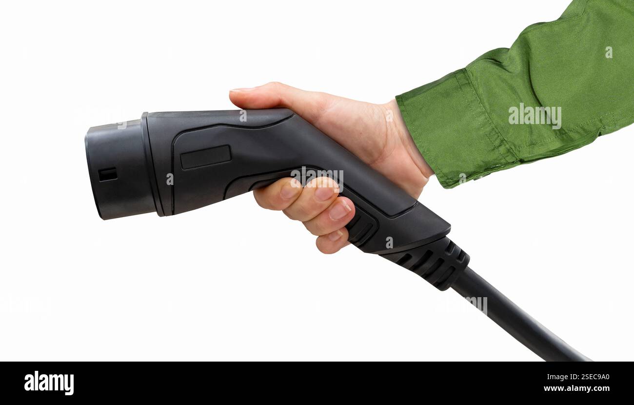 Isolated black EV charging plug in female hand. Electric car charging ...