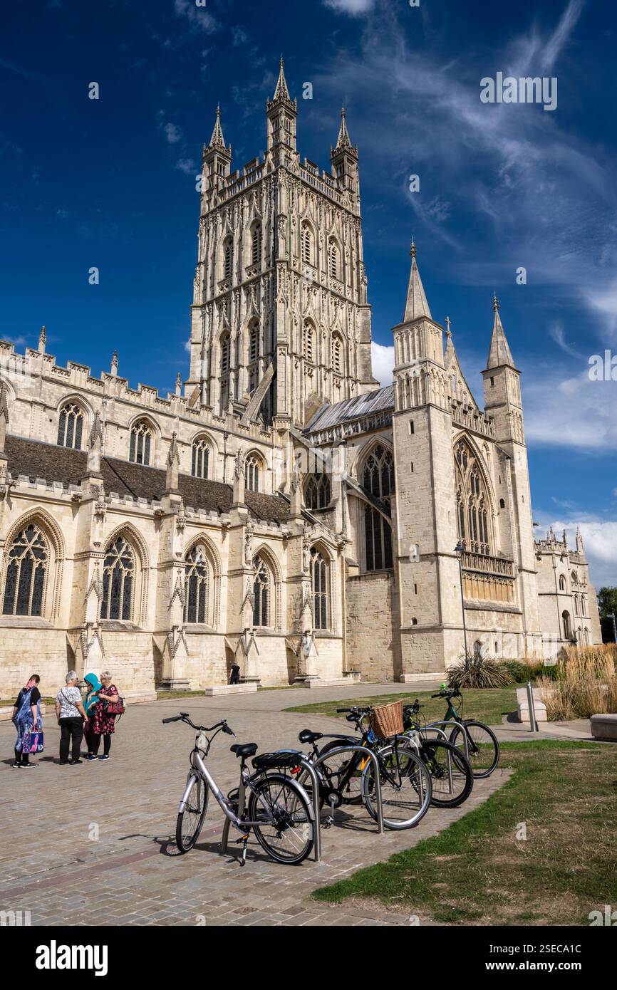 Bicycles are parked in College Green outside the gothic Gloucester ...
