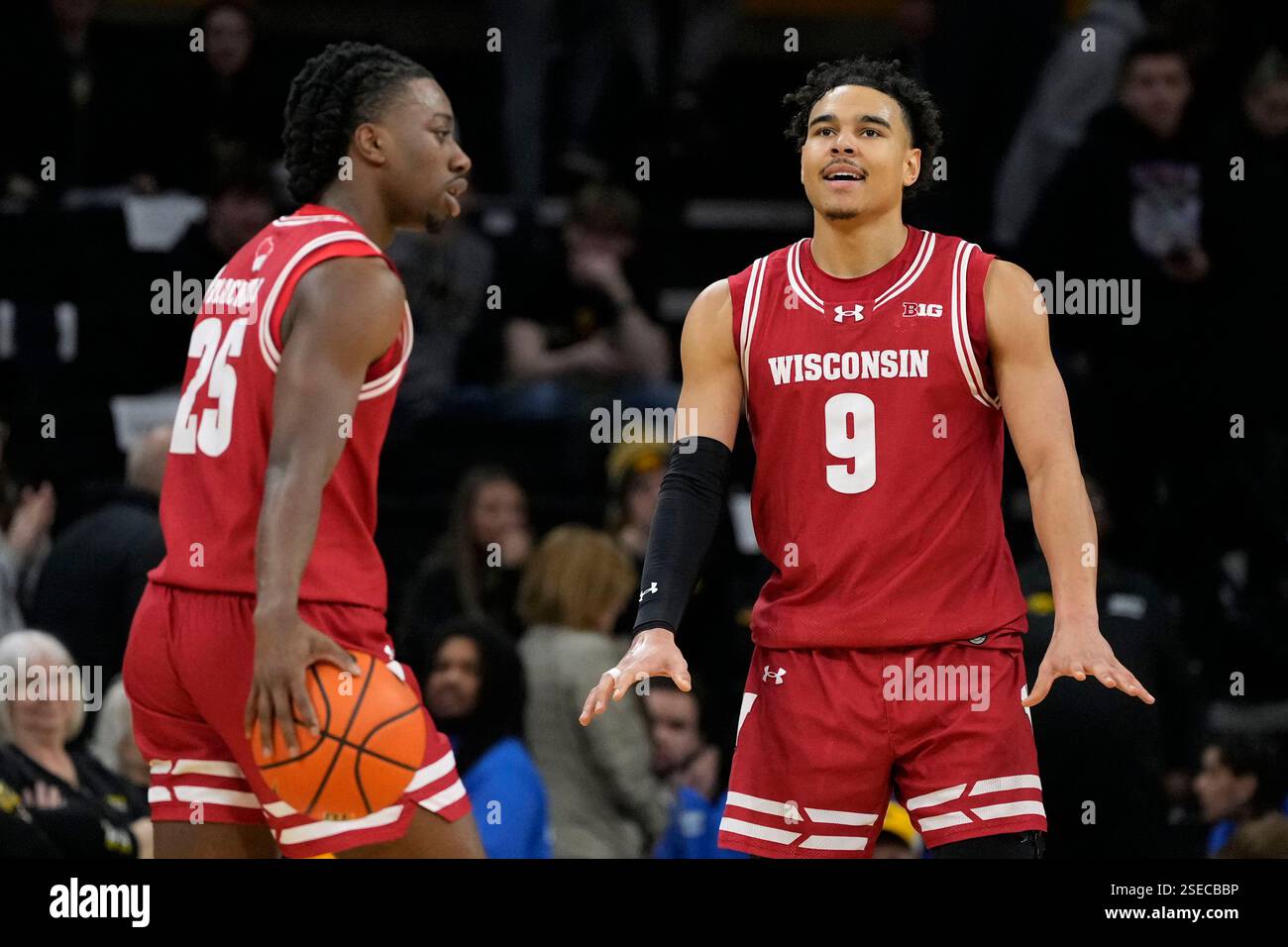 Wisconsin guard John Tonje (9) celebrates with teammate John Blackwell ...