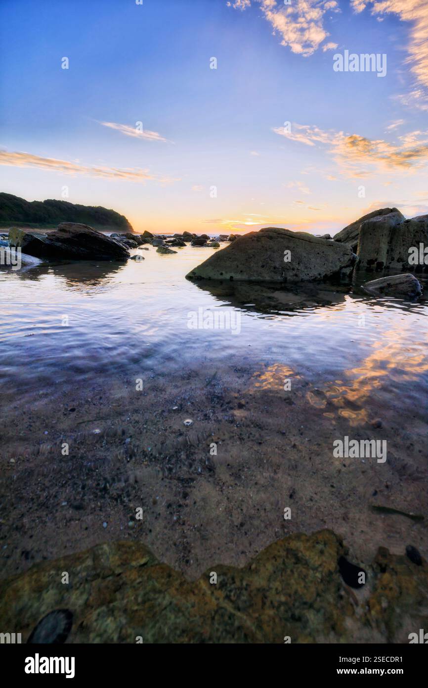 Calm waters between sandstone rocks of Hams beach of Pacific coast in ...