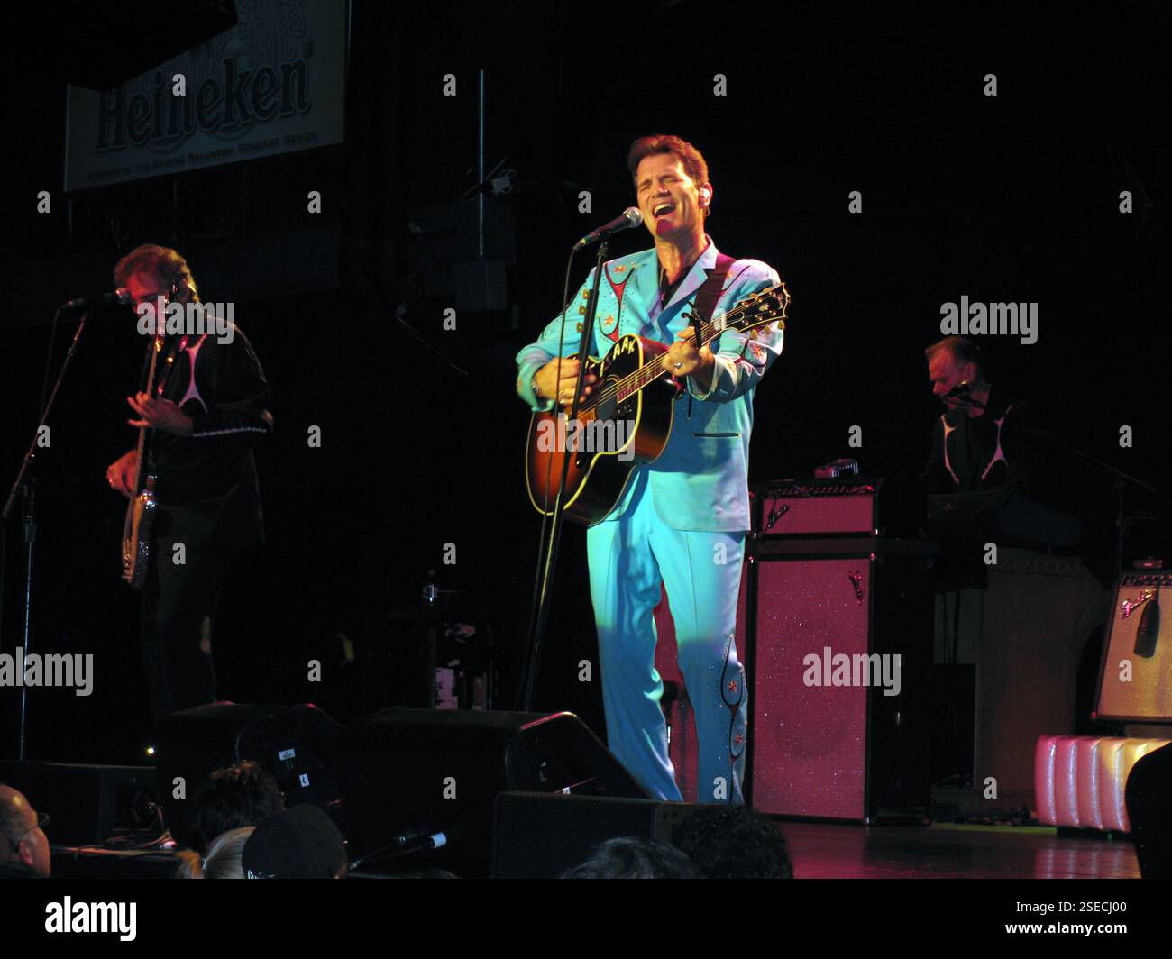 Chris Isaak performing on stage with his band at Hampton Beach casino ...