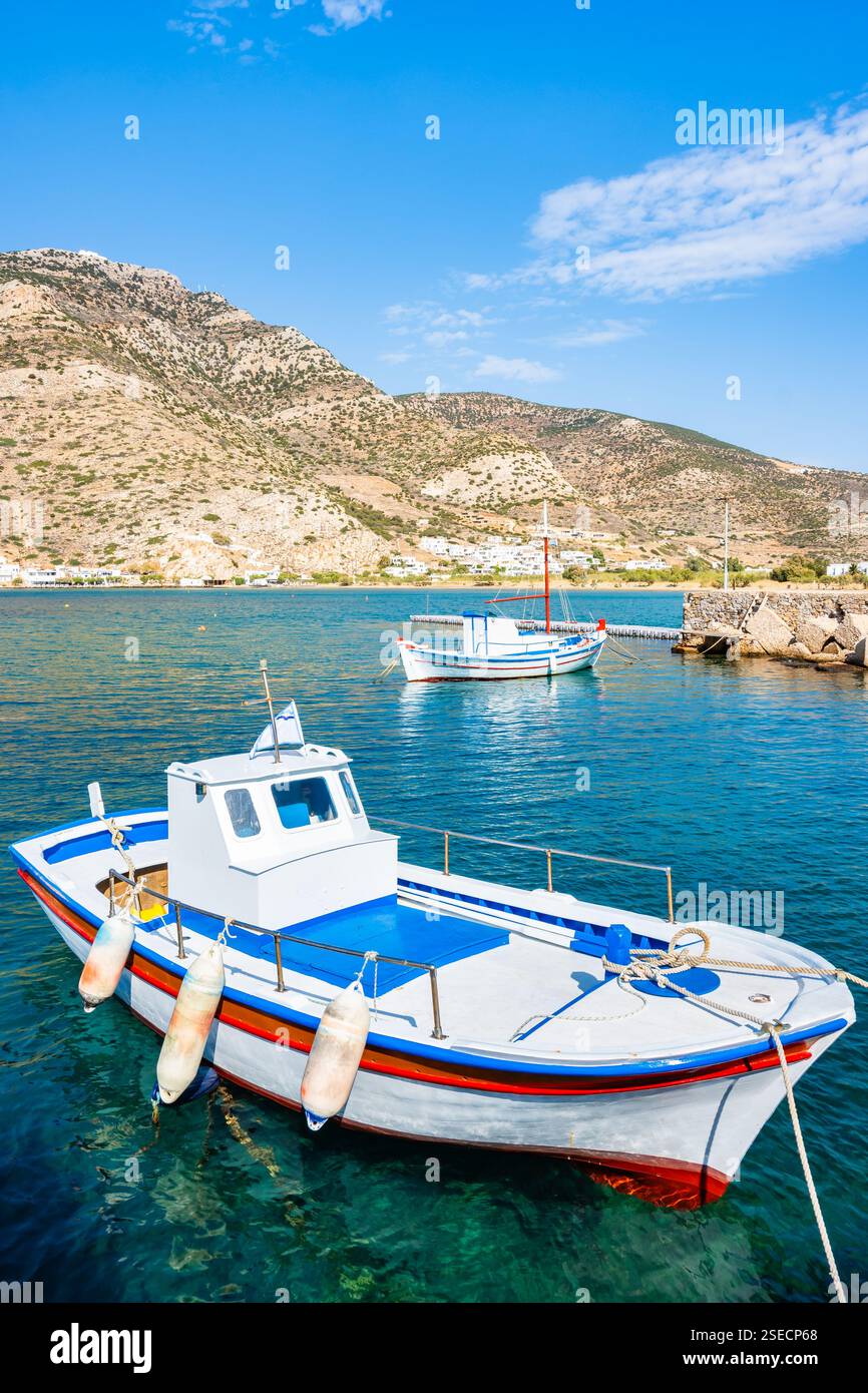 Traditional colorful Greek fishing boats anchoring in Kamares bay port ...