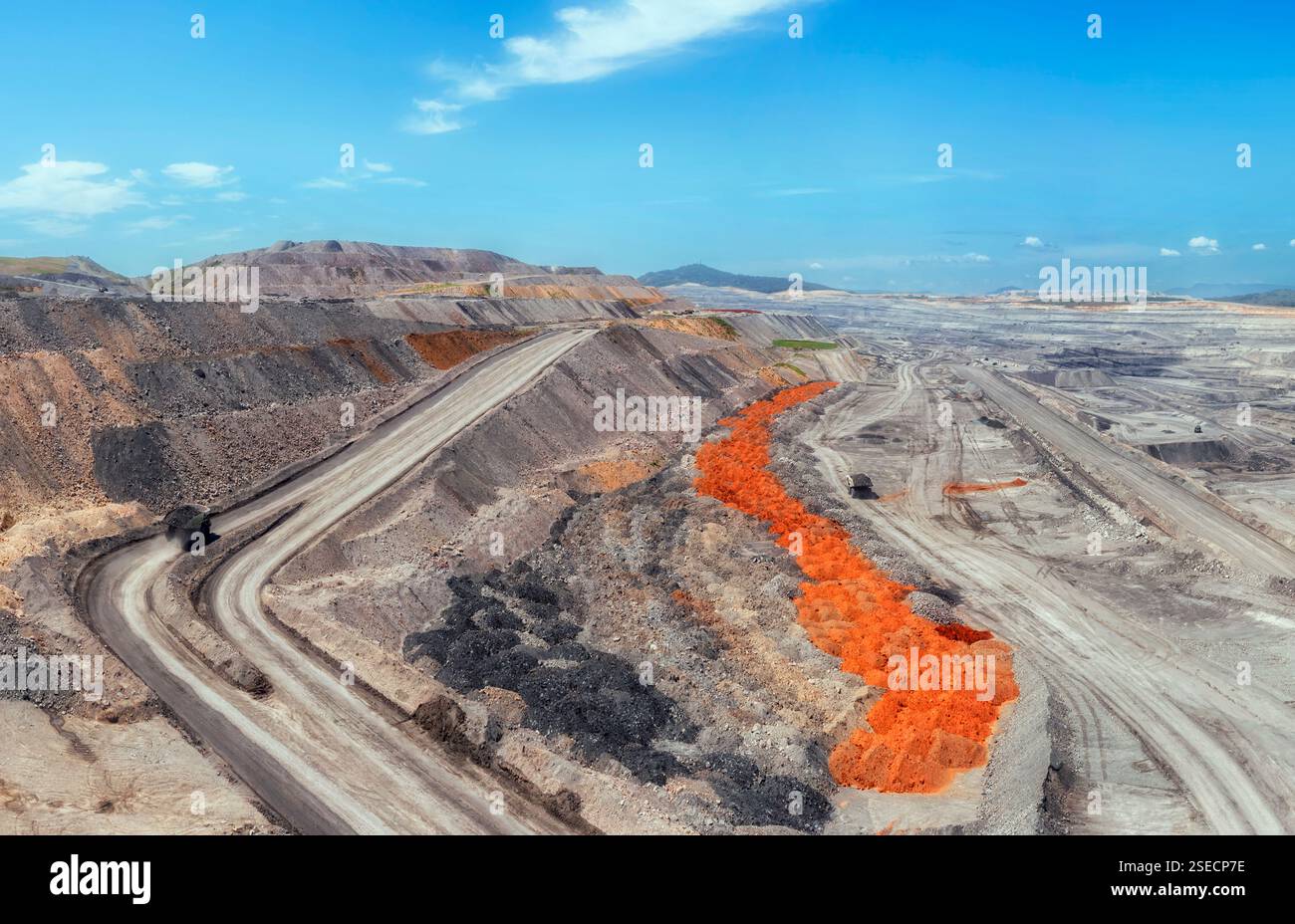 Earth moving trucks in wide open pit black coal mine in Hunter valley ...