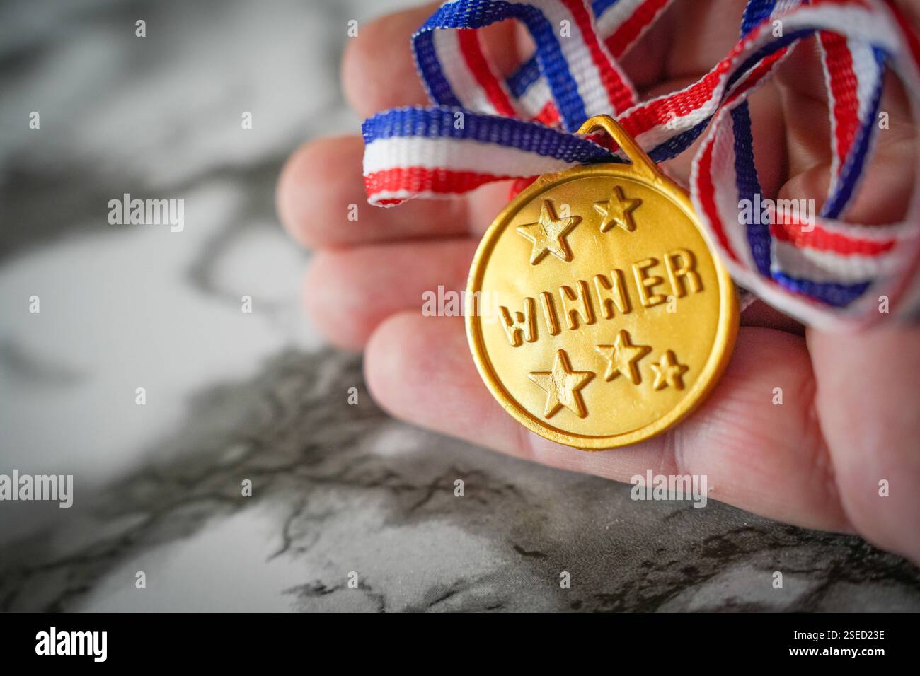 Germany. Winner symbol photo of a gold medal with WINNER lettering in ...