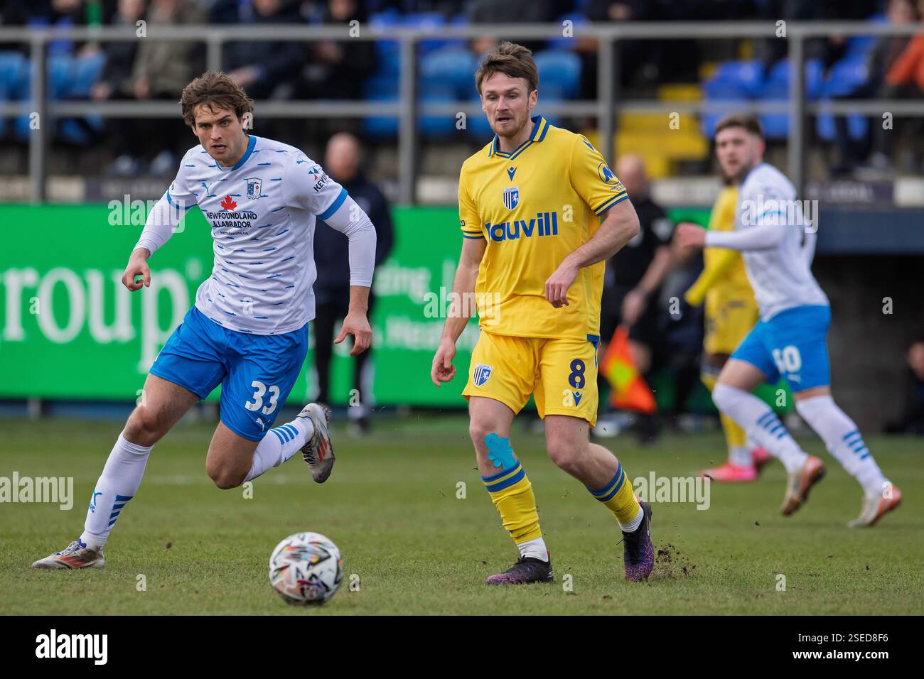 Barrow's Aaron Pressley in action with Gillingham's Armani Little ...