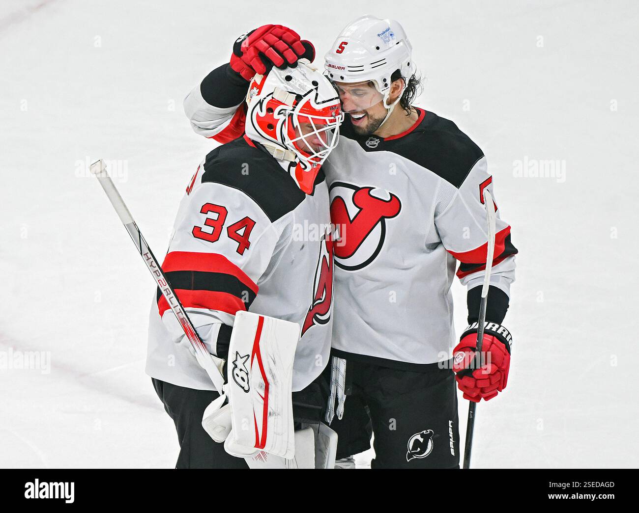 New Jersey Devils goaltender Jake Allen (34) celebrates with teammate ...