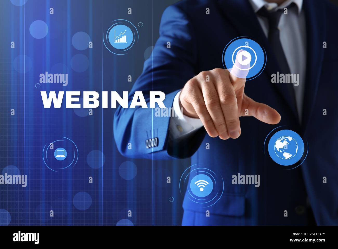 Webinar. Businessman using virtual screen with icons against dark ...