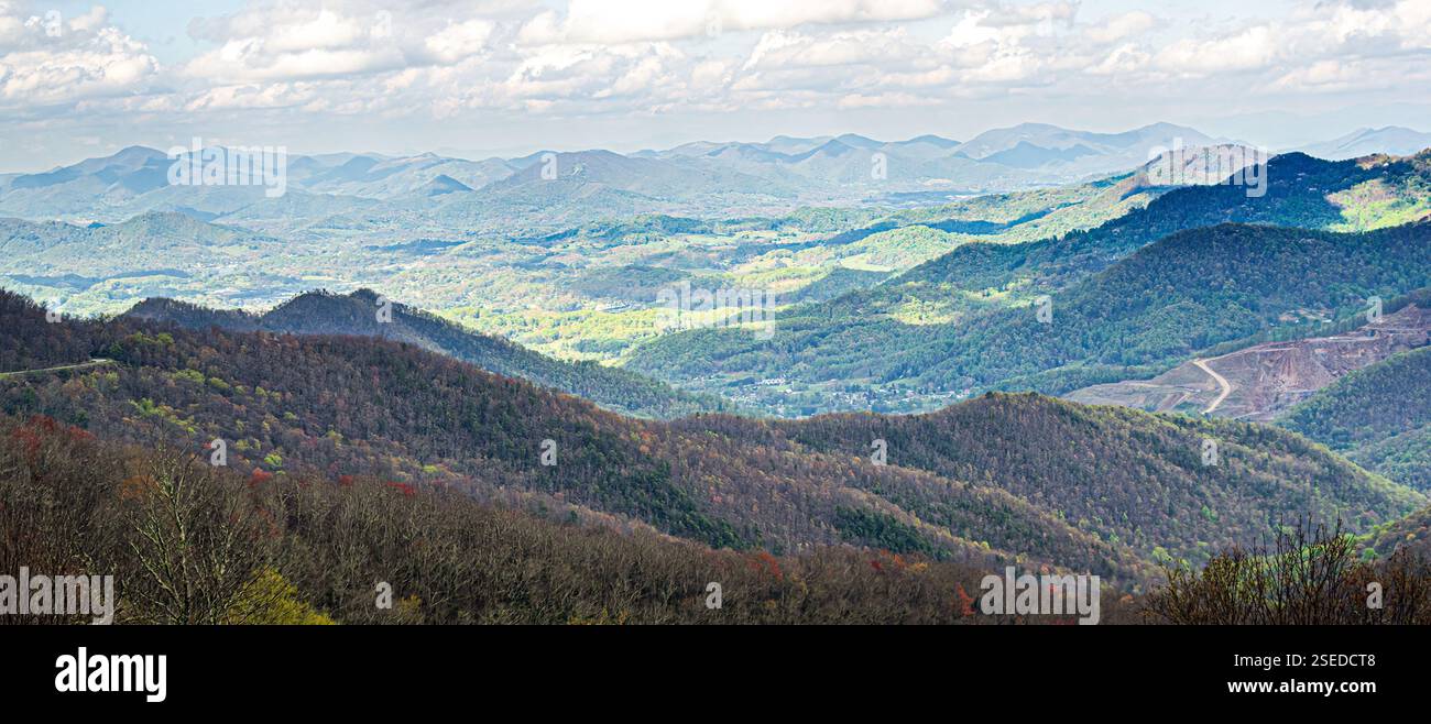 Scenic panoramic view of rolling mountains and lush valleys under a ...
