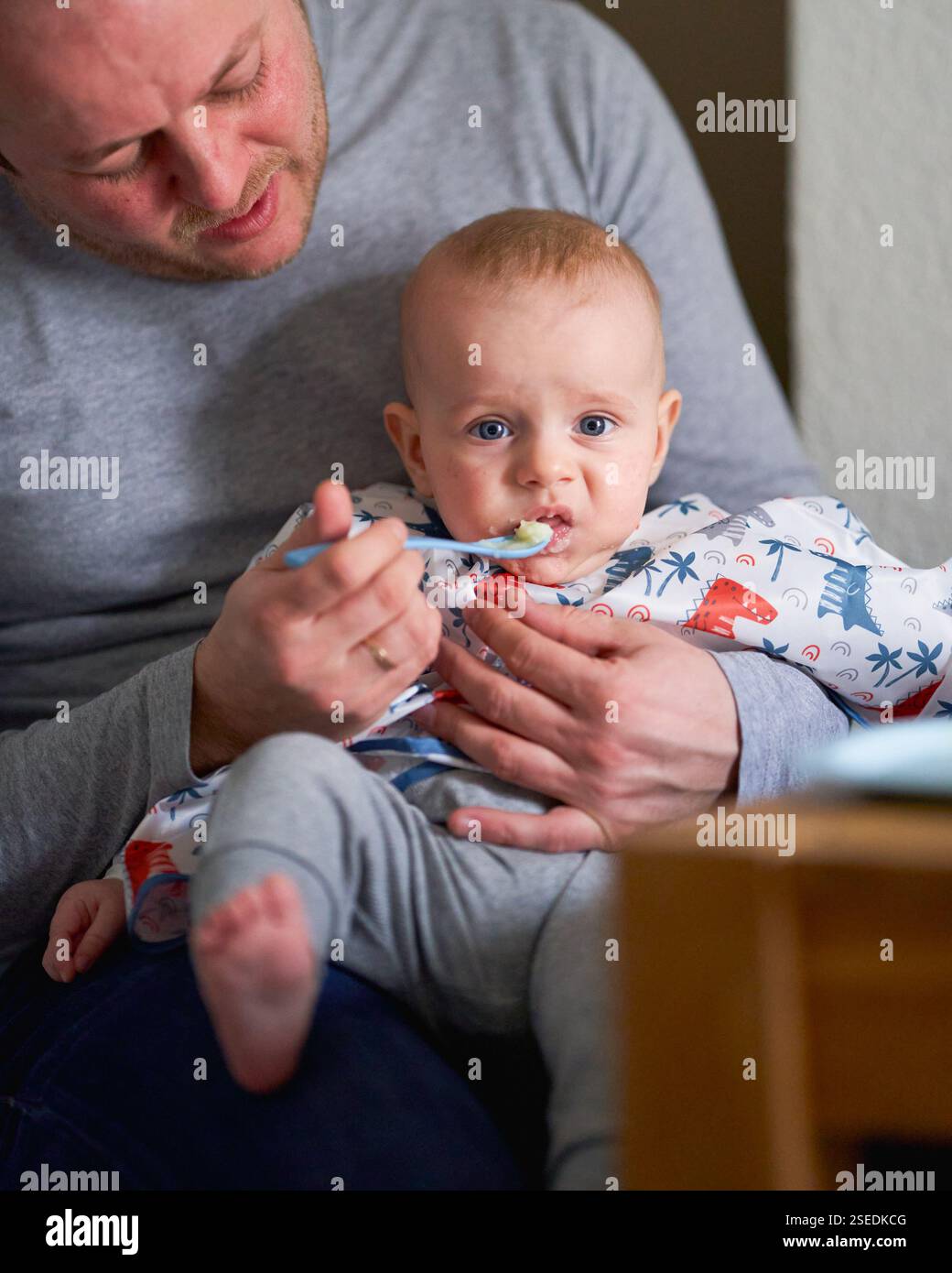 the first complementary feeding of a six-month-old baby with vegetable ...