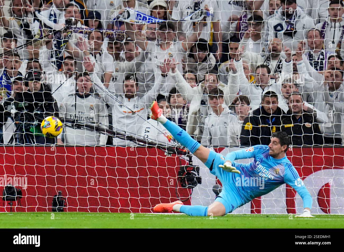 Real Madrid's goalkeeper Thibaut Courtois fails to stop a penalty shot ...