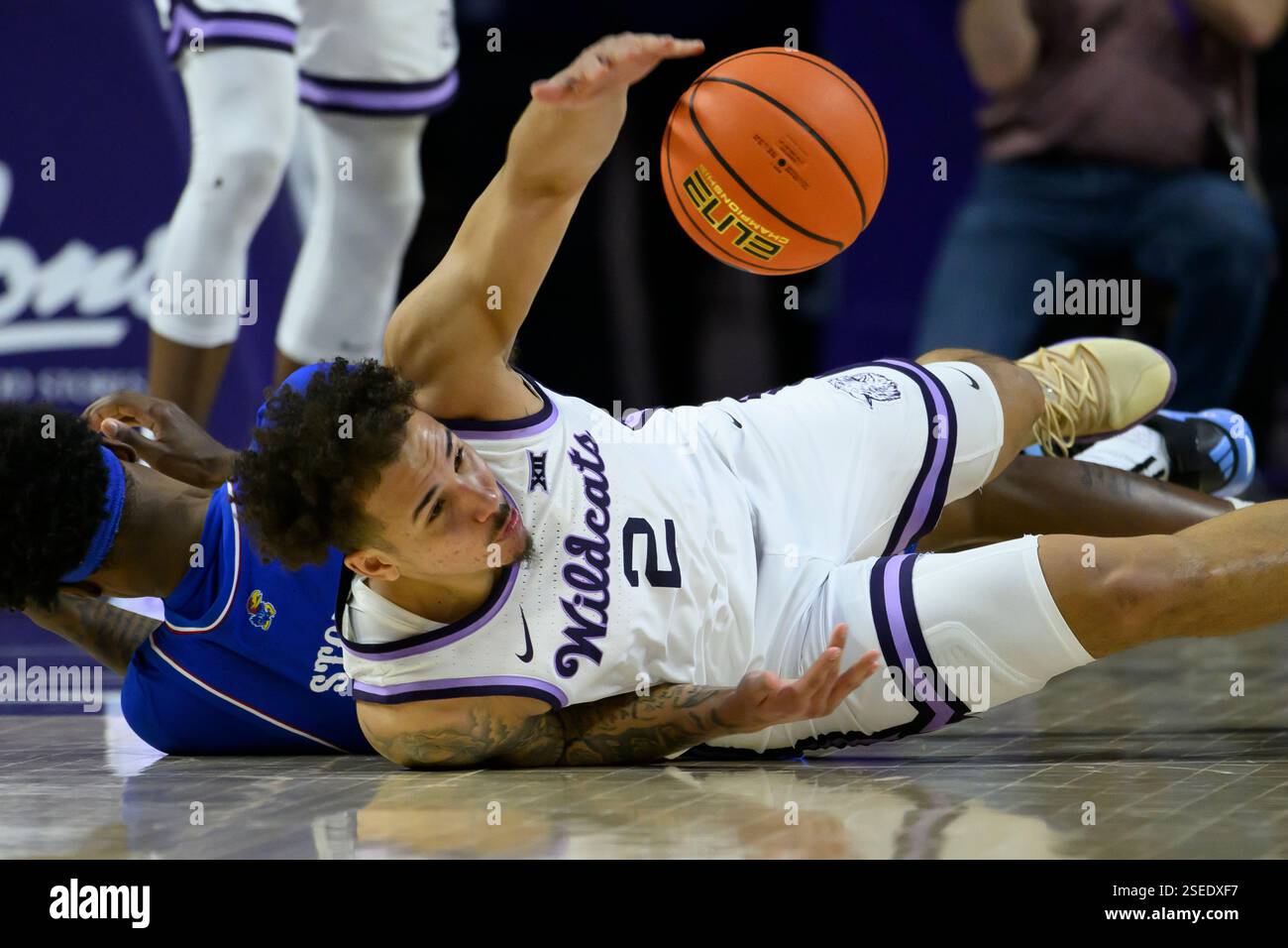 Kansas State guard Max Jones (2) goes to the floor chasing a ball with ...