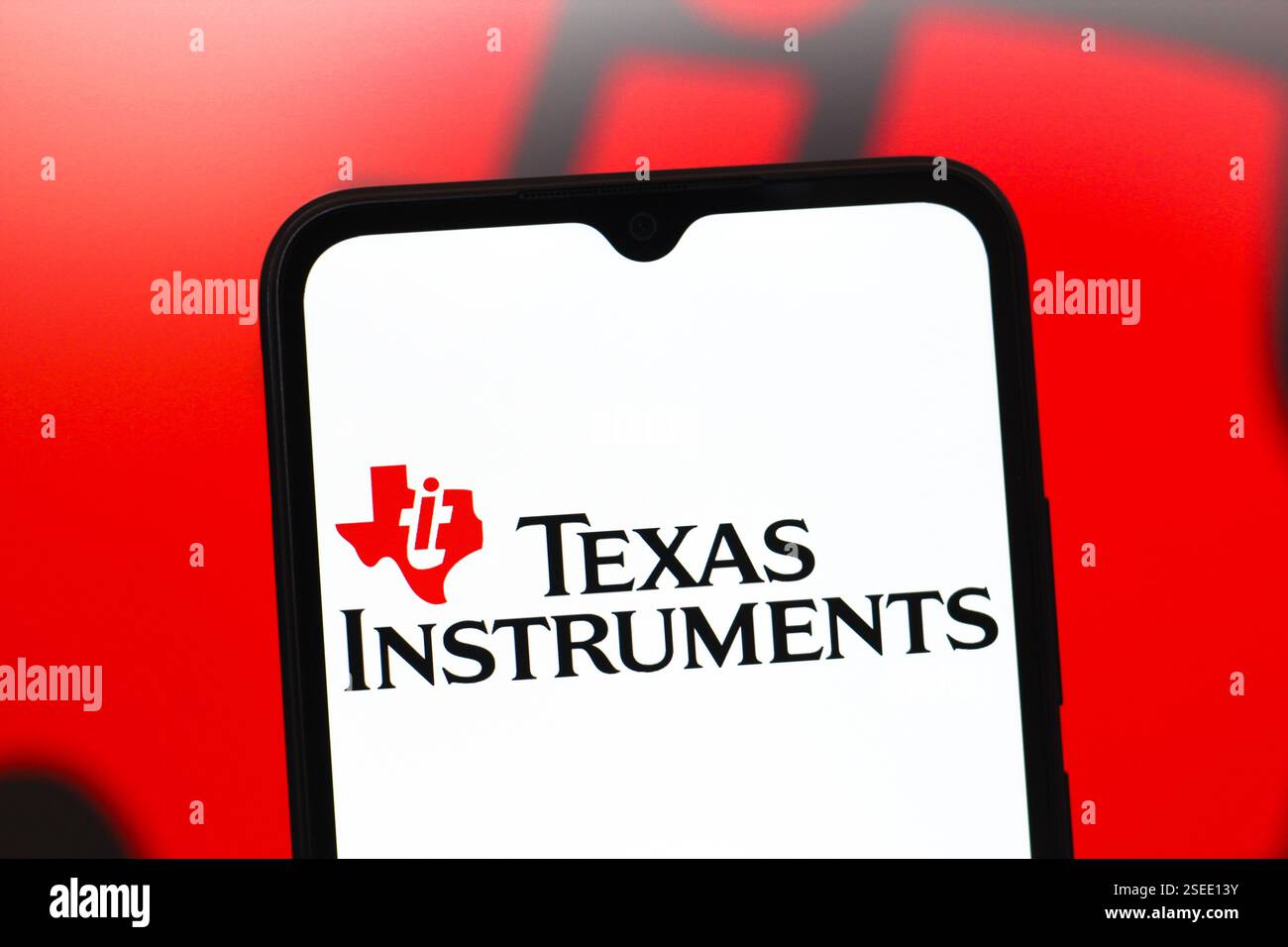 In this photo illustration, the Texas Instruments Incorporated (TI) logo is seen displayed on a ...