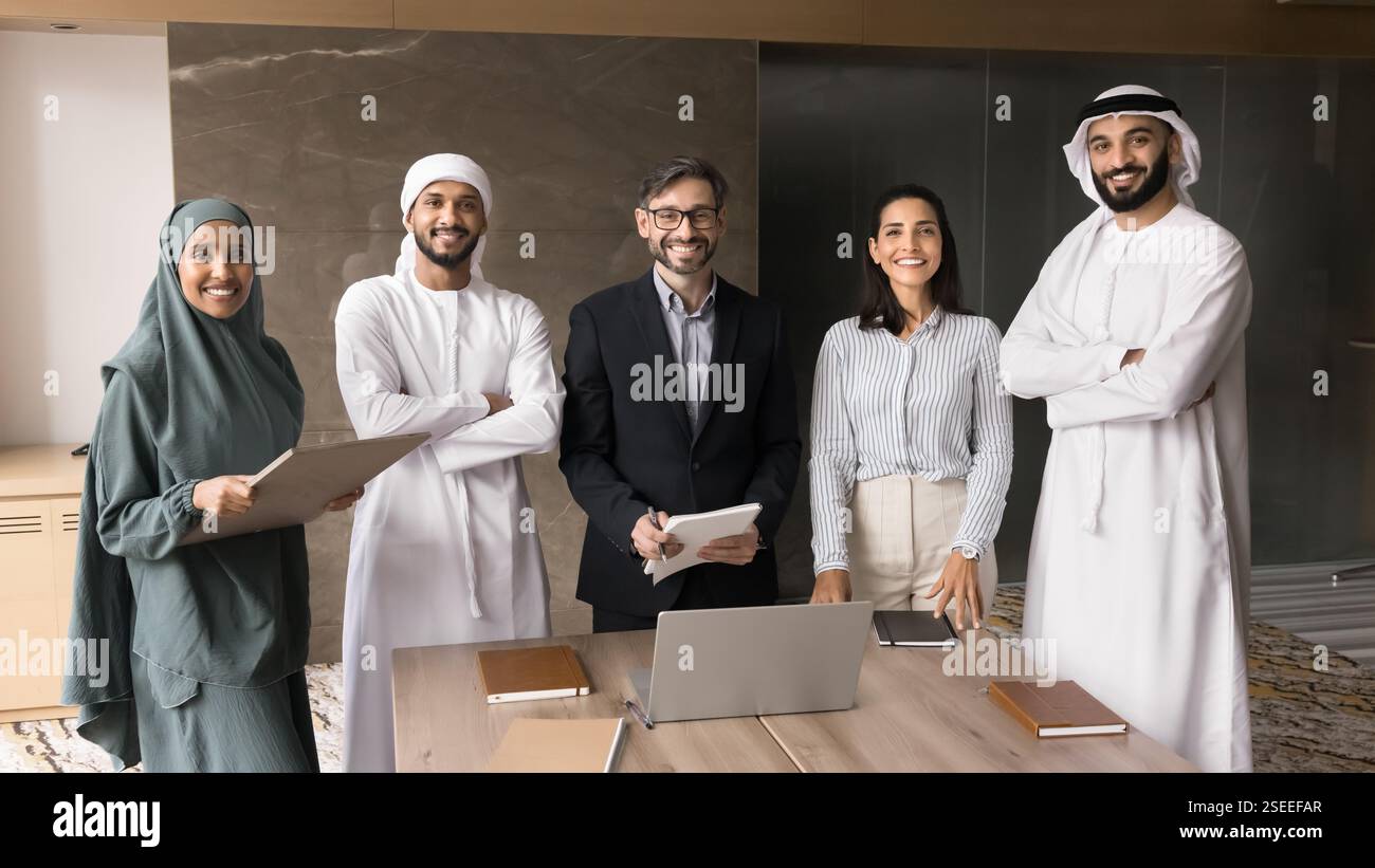 Five multicultural teammates, corporate staff members posing in office ...
