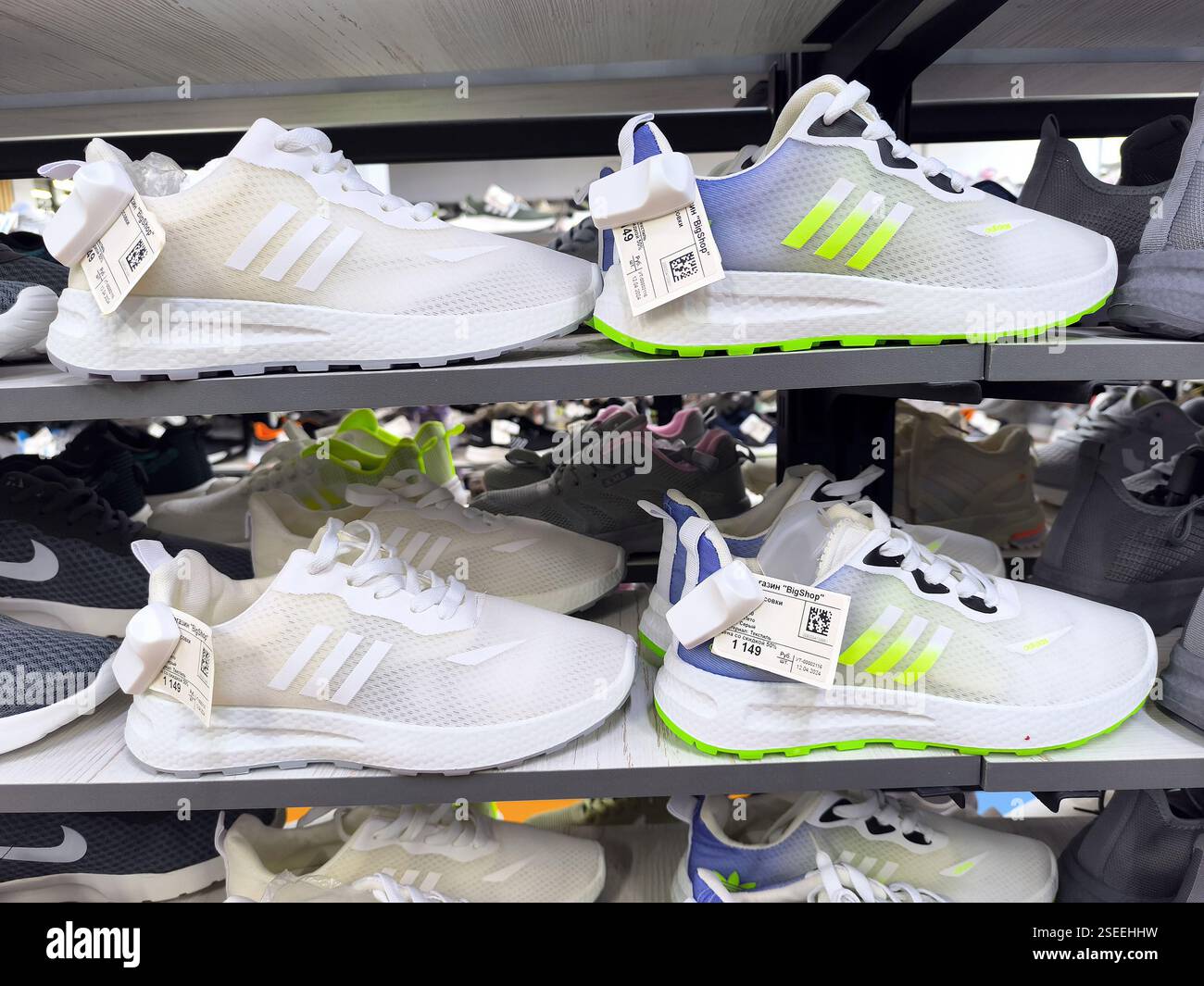 Adidas running shoes on display in store with price tags Stock Photo ...