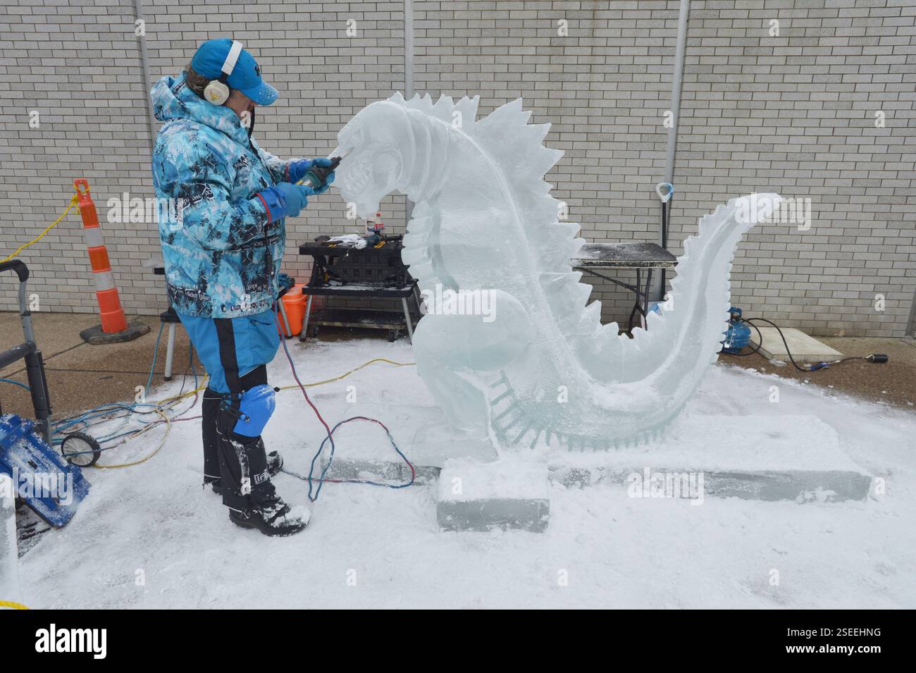 Professional ice carver Dan Rebholz works on a sculpture Saturday, Feb ...