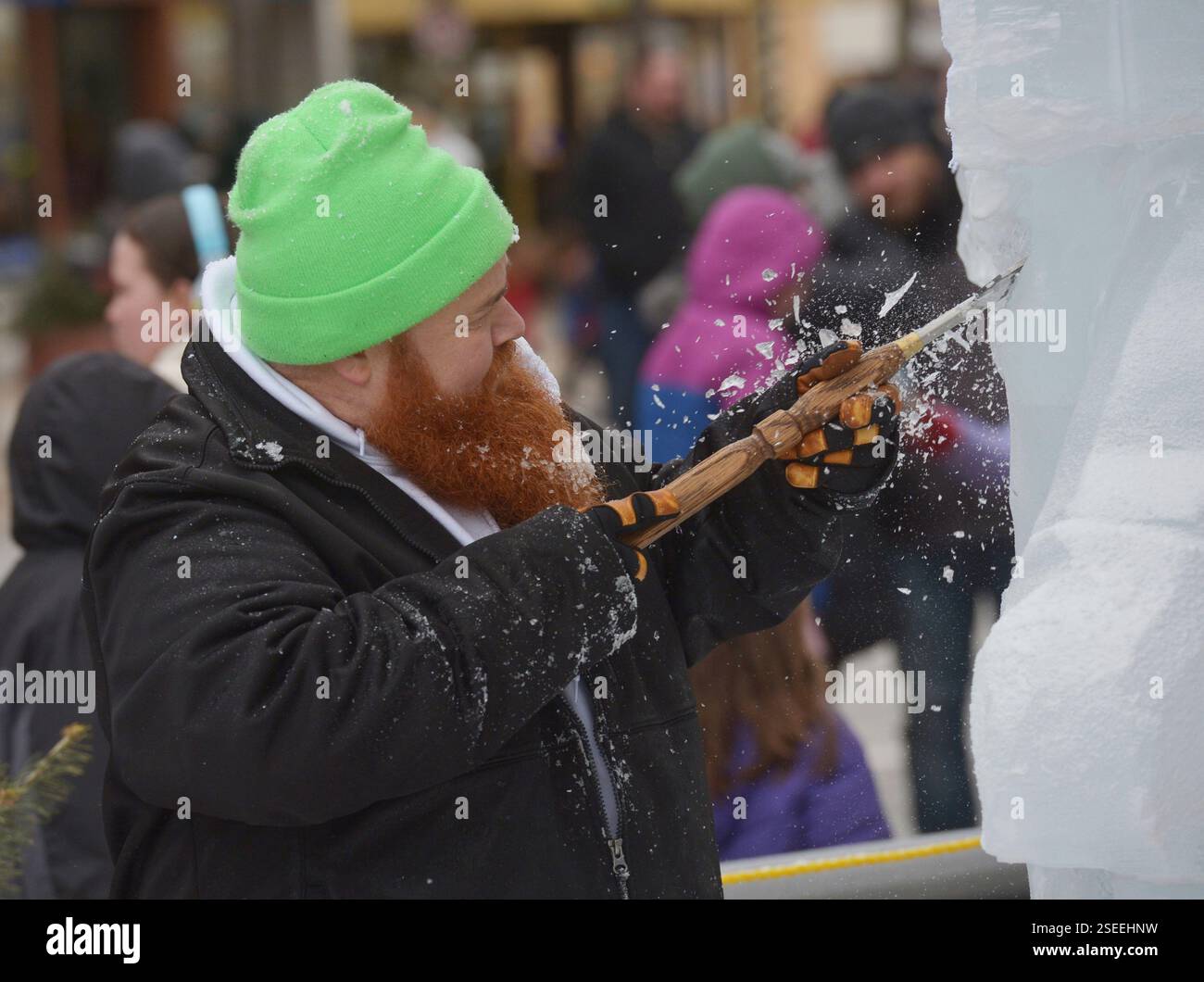 Professional ice carver Tator Edwards works on a sculpture Saturday ...