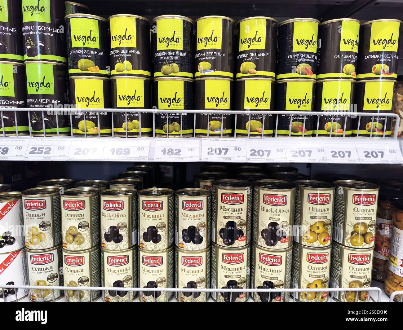 Canned olives display on supermarket shelves Stock Photo - Alamy