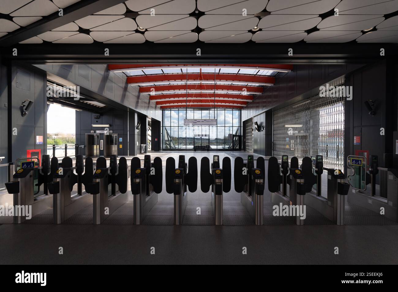 Modern ticket barriers at the new Brent Cross West station. Passengers ...
