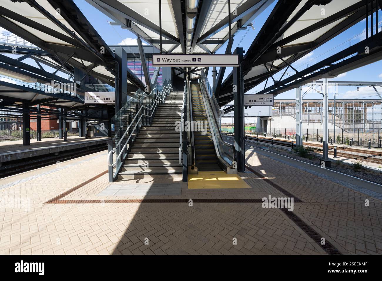 Modern escalator and stairs at the London, UK, Brent Cross West station ...