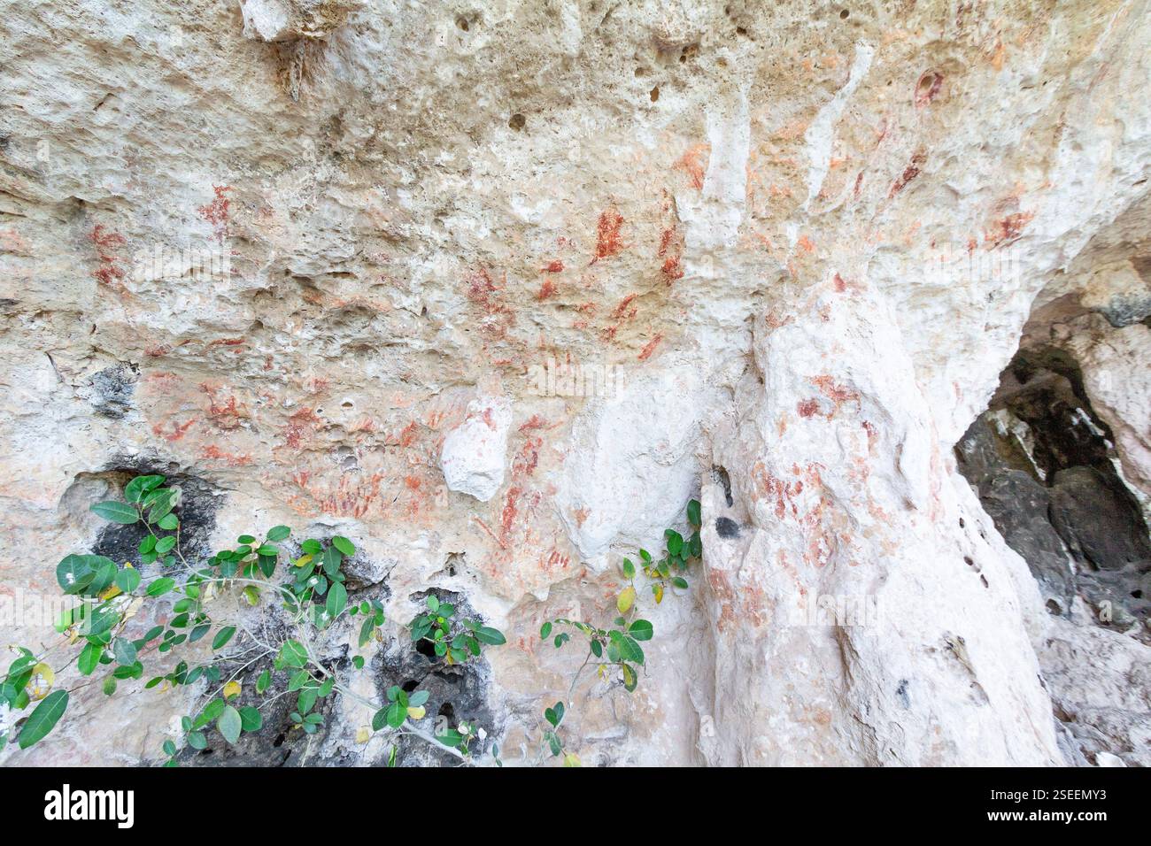 Prehistoric red hematite hand prints on a cave wall at historic Lamanok ...