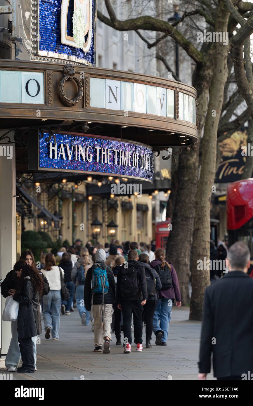 Pedestrians walk past the London theatre, the Novello Theatre ...