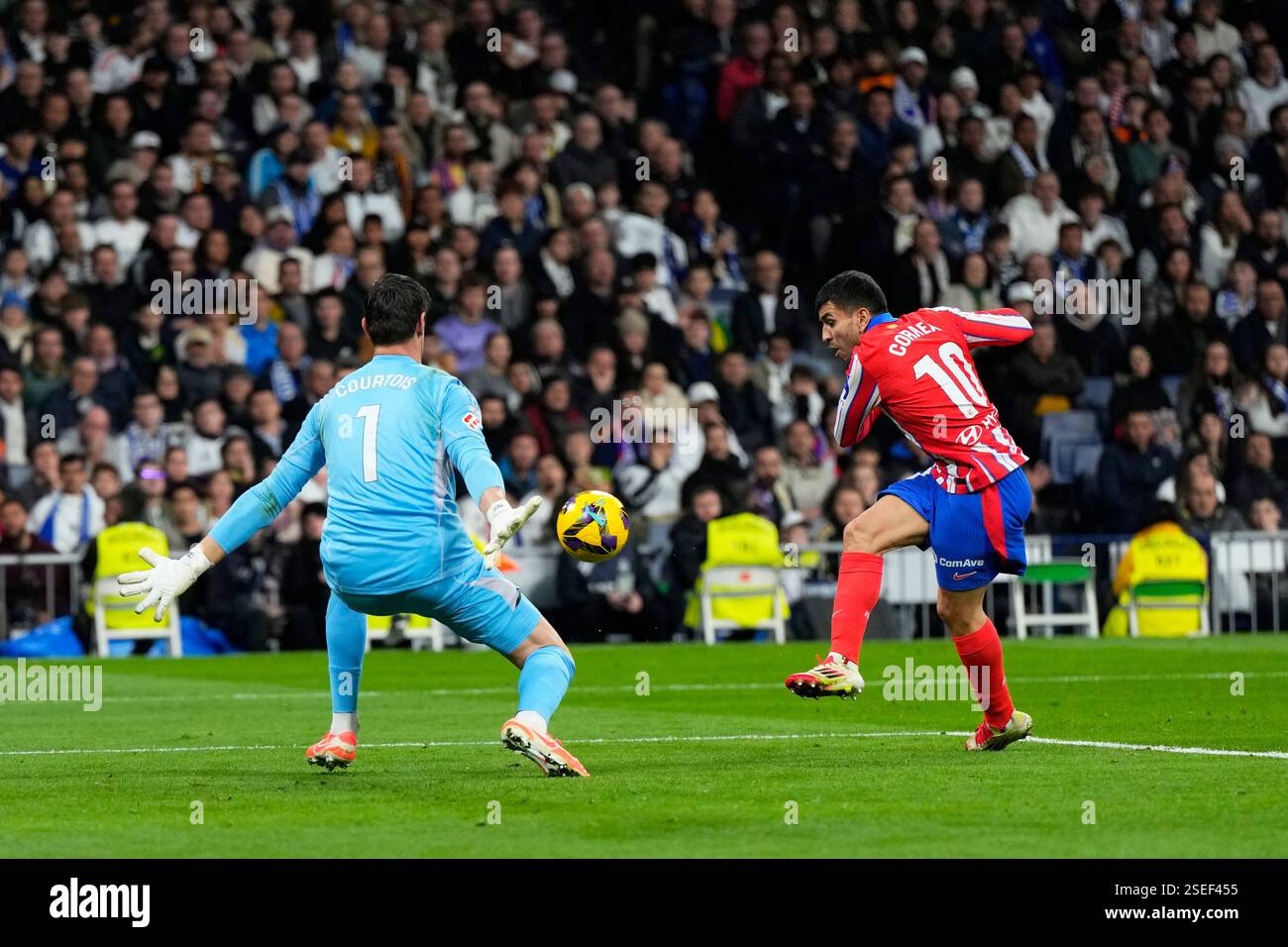 Real Madrid's goalkeeper Thibaut Courtois stops a shot at goal by ...