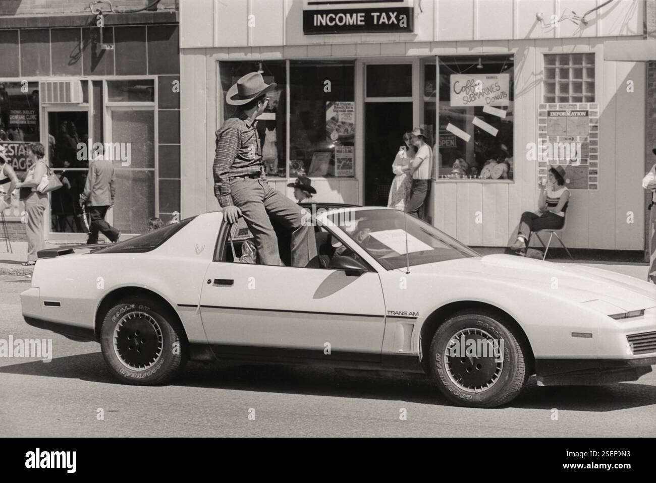 Parade participant sitting on a 1982 Pontiac Trans Am at the Crowsnest ...