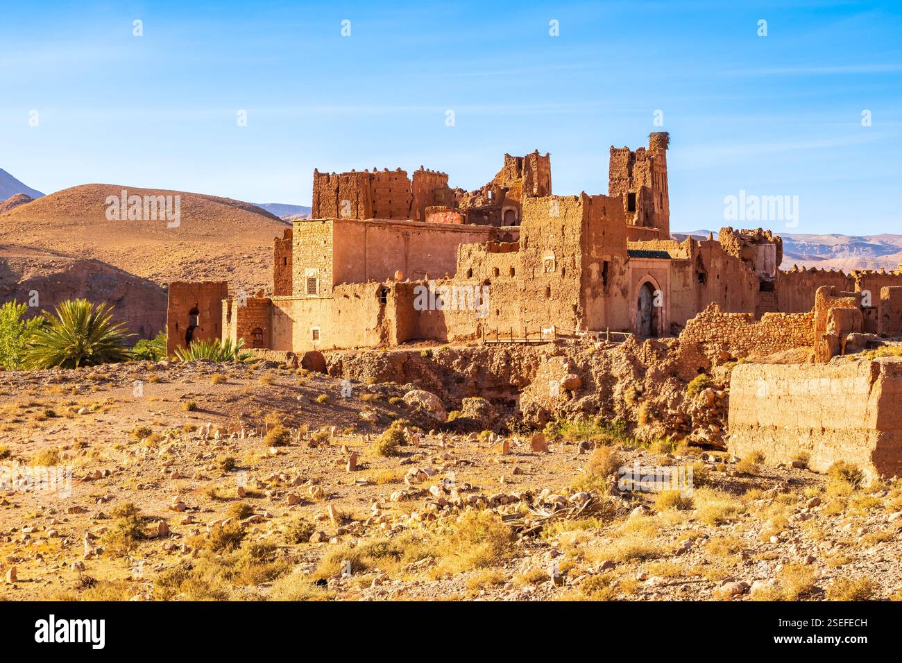 Traditional riad kasbah building in mountain landscape near Armiter ...