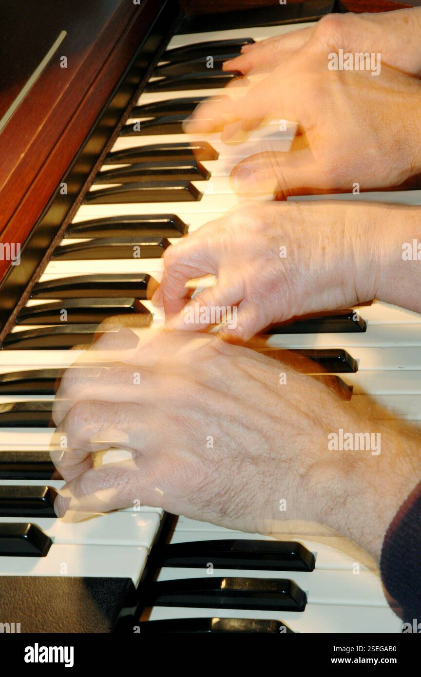 Four hands piano practice hi-res stock photography and images - Alamy