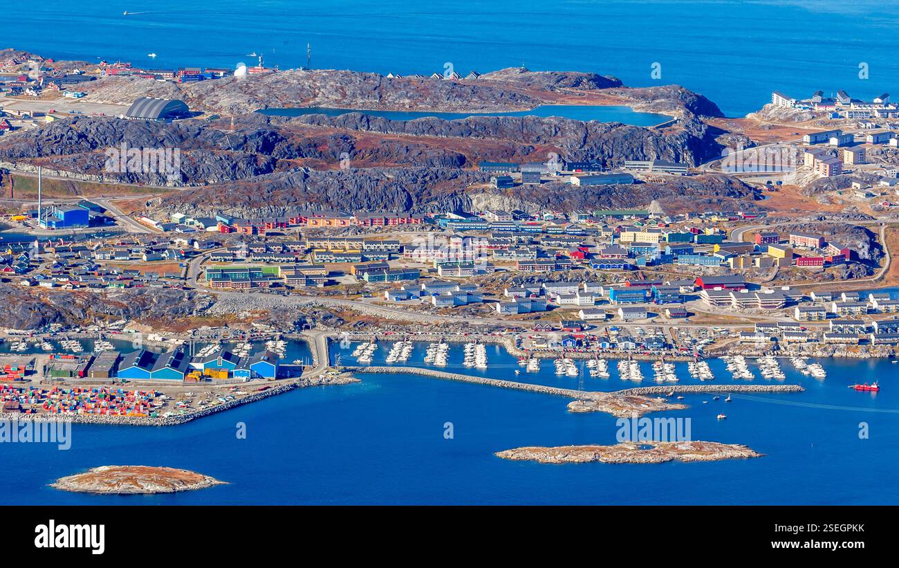 Colorful arctic Inuit houses at the fjord shore with marina port, Nuuk ...