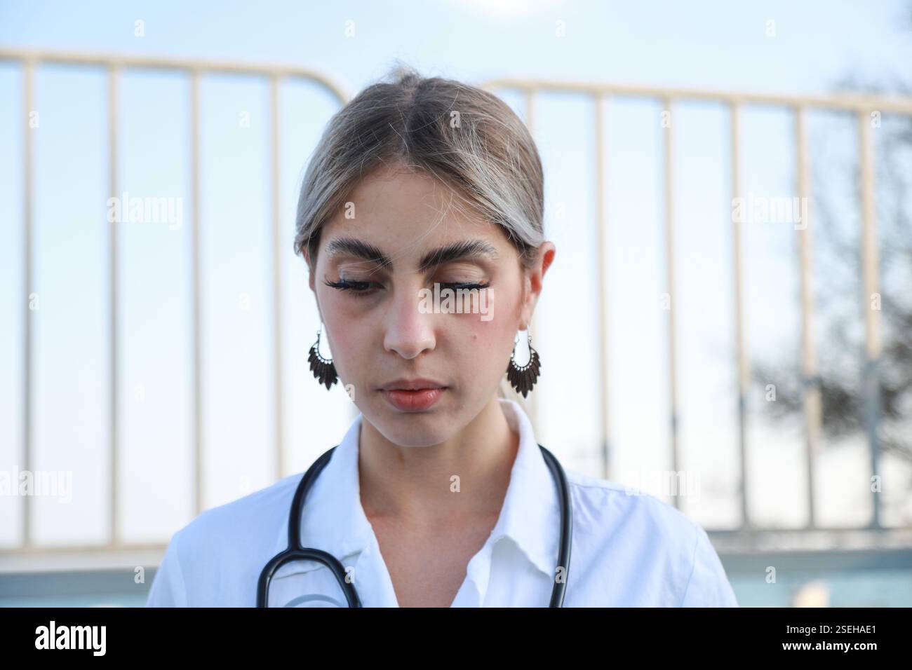 Woman Doctor Administering Treatment in an Outdoor Camp Stock Photo - Alamy